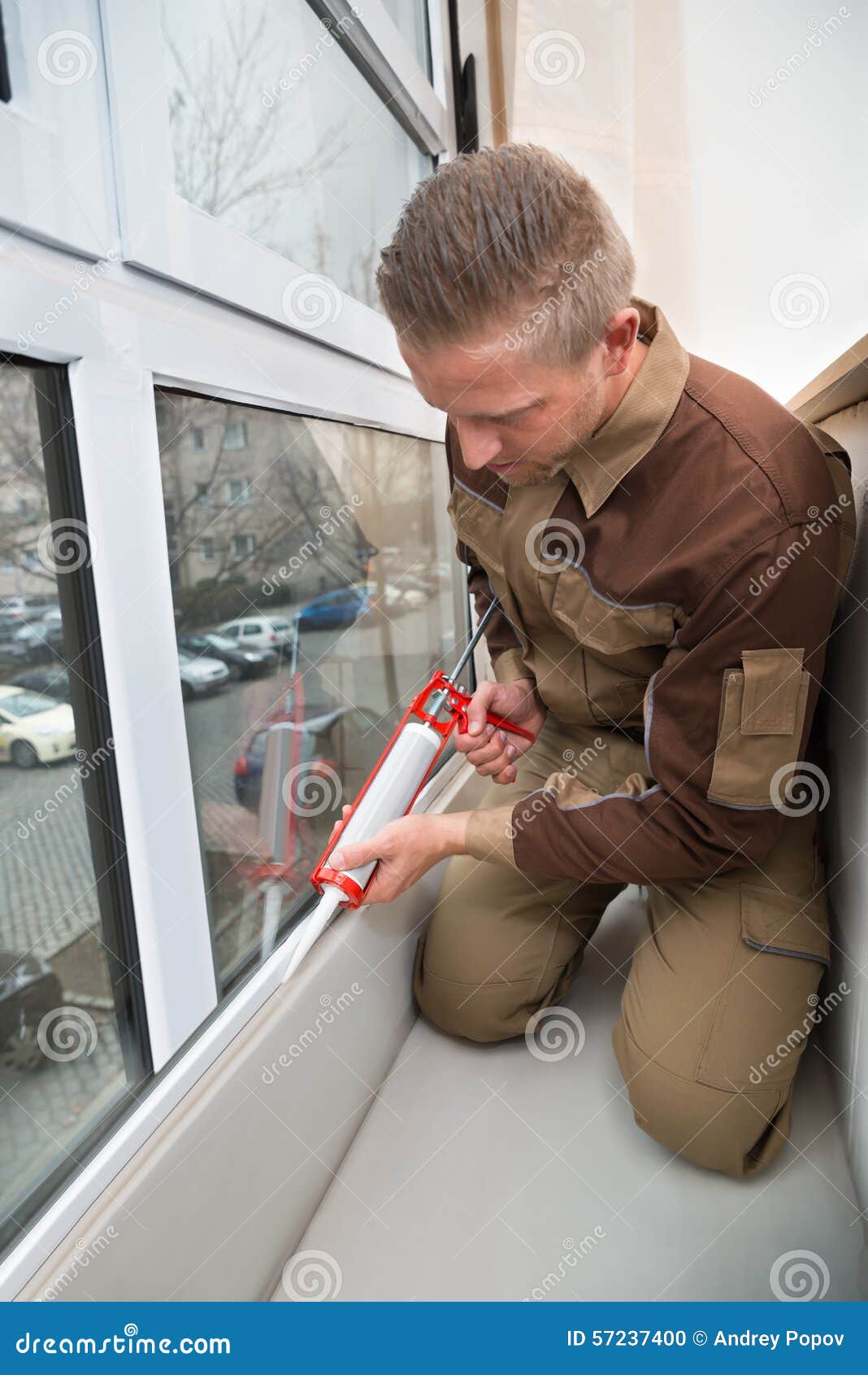 Worker Applying Glue with Silicone Gun Stock Photo - Image of room ...