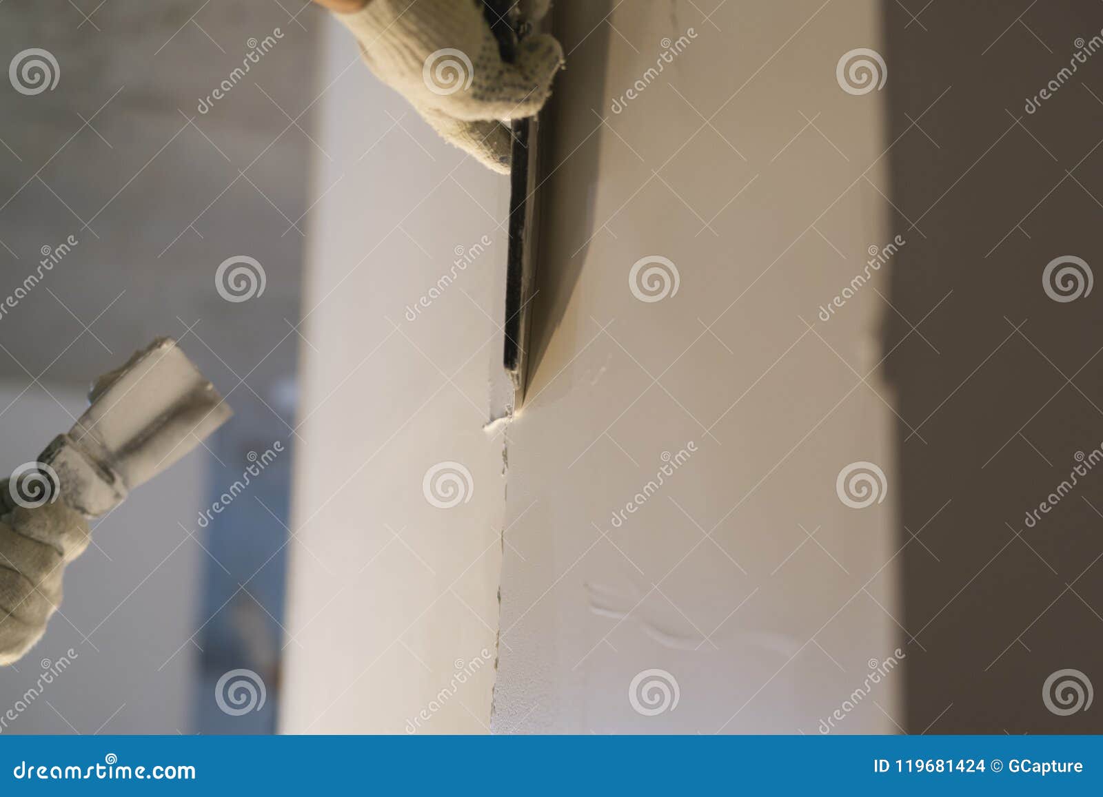 Worker Applying Putty on the Wall with Putty Knife Stock Photo - Image ...