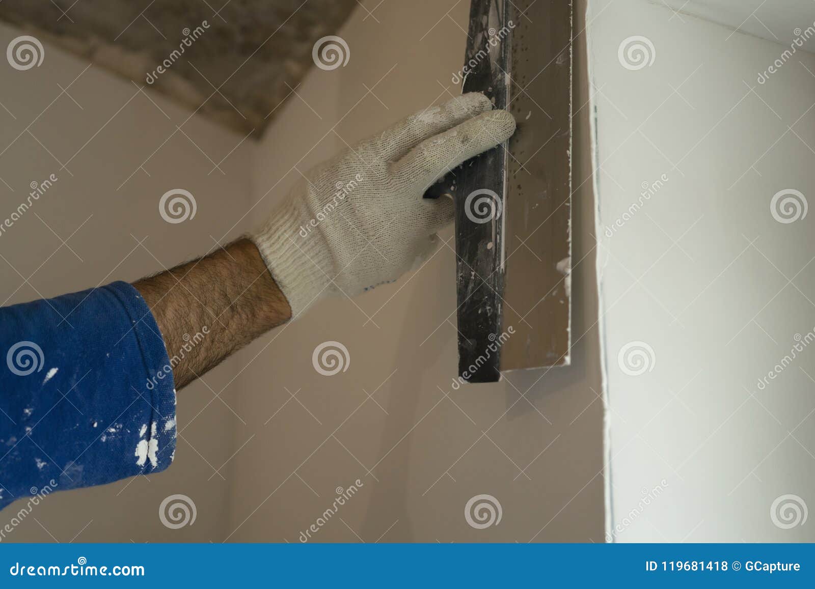 Worker Applying Putty on the Wall with Putty Knife Stock Photo - Image ...