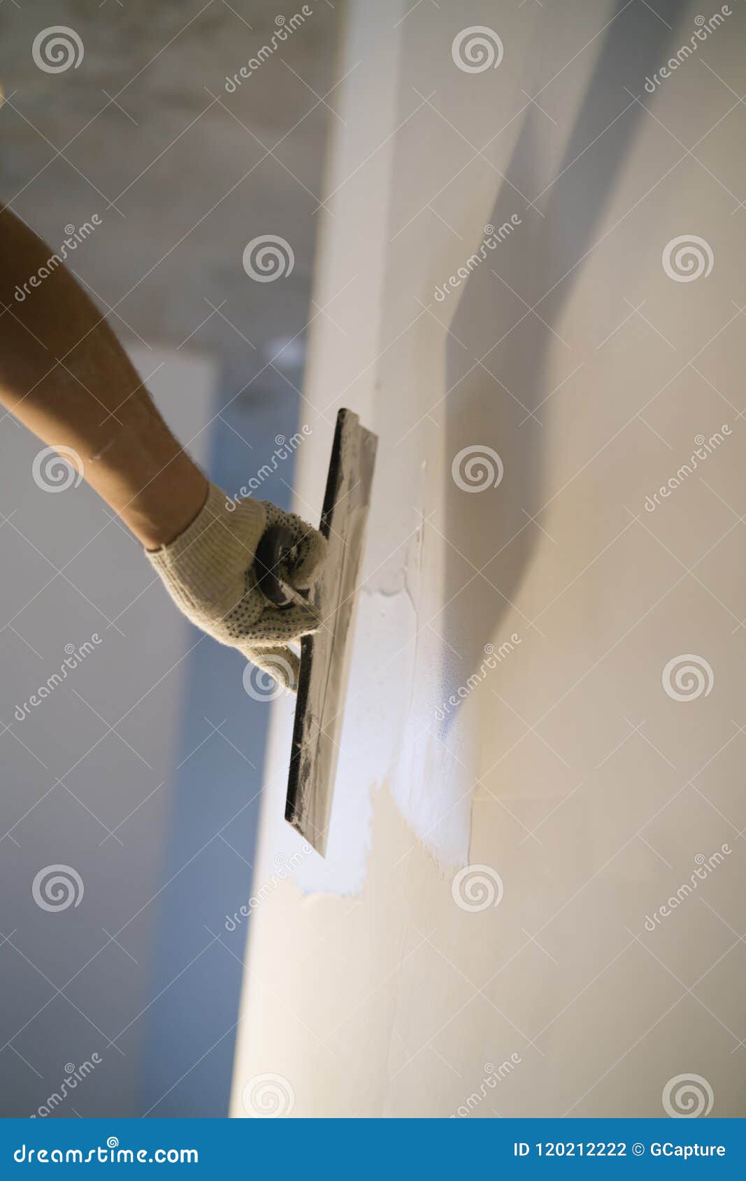 Worker Applying Putty on the Wall with Putty Knife Stock Photo - Image ...