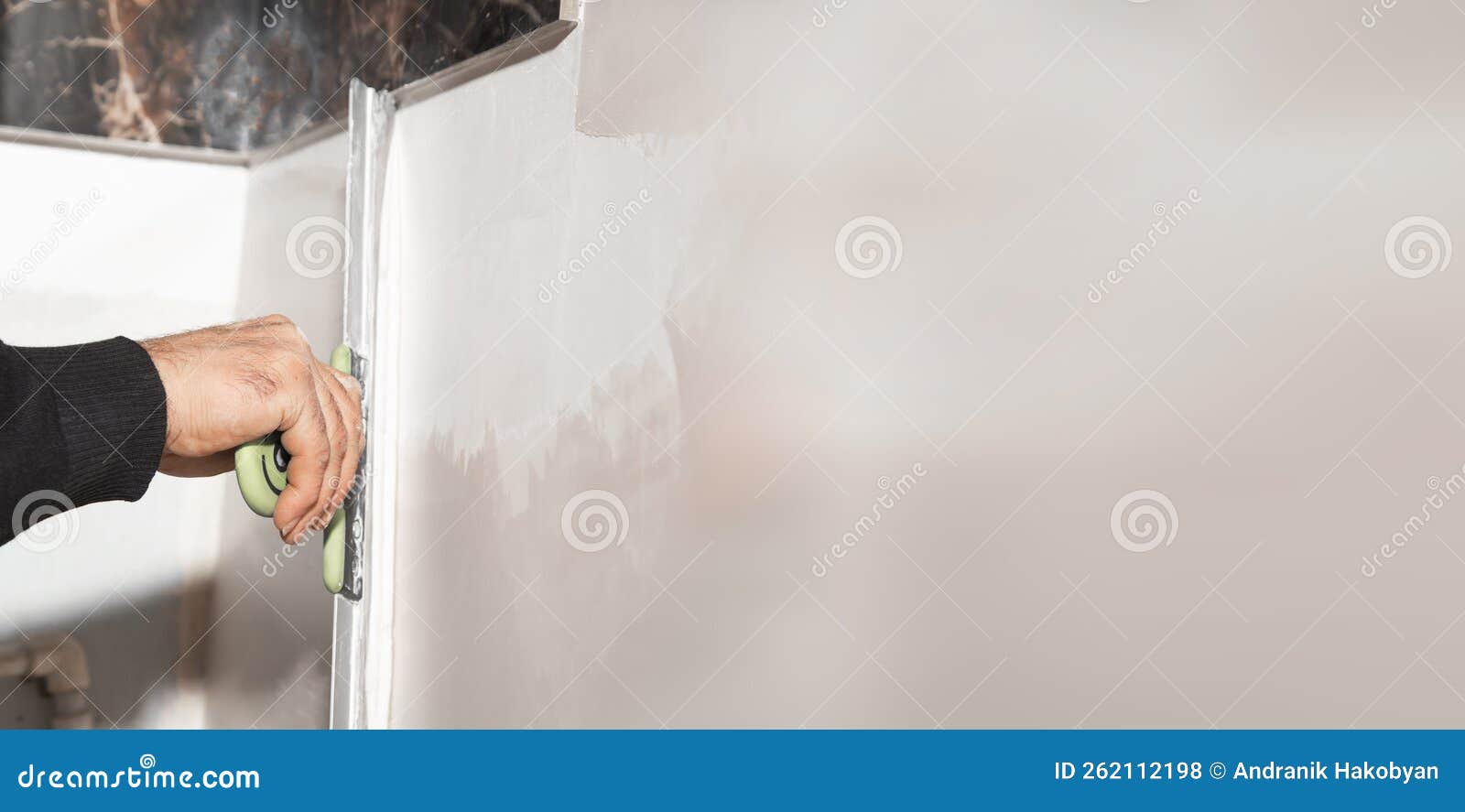 Worker is Applying Putty on a Wall. Renovating House Stock Photo ...