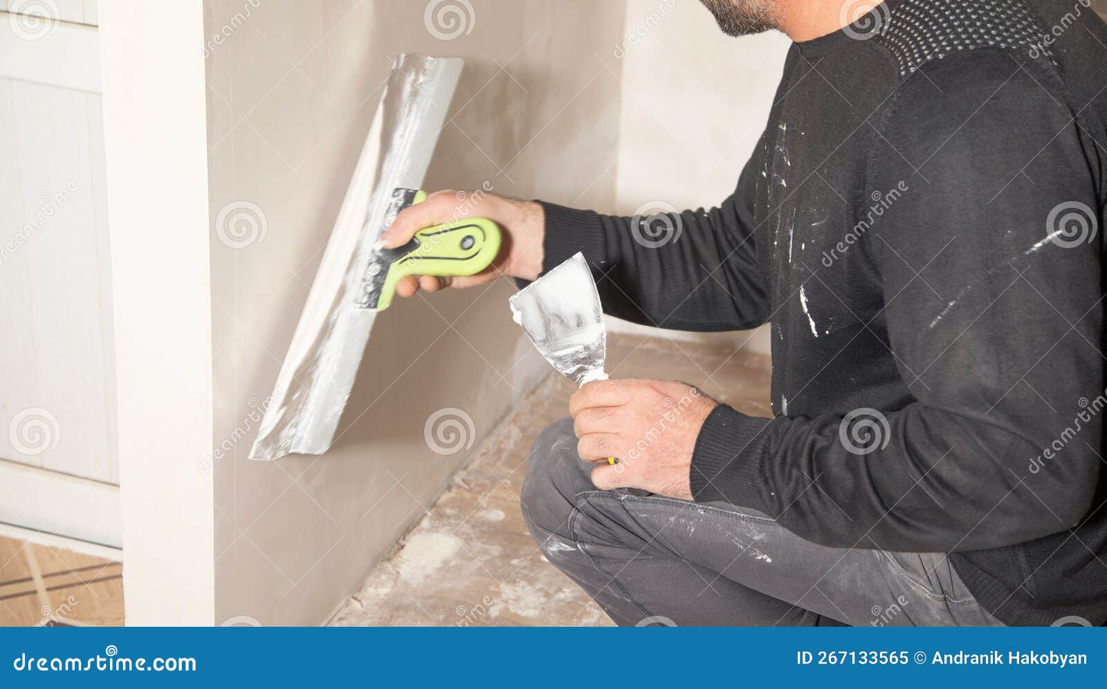 Worker is Applying Putty on a Wall. Renovating House Stock Image ...