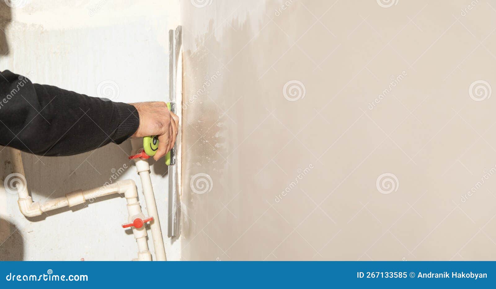 Worker is Applying Putty on a Wall. Renovating House Stock Image ...