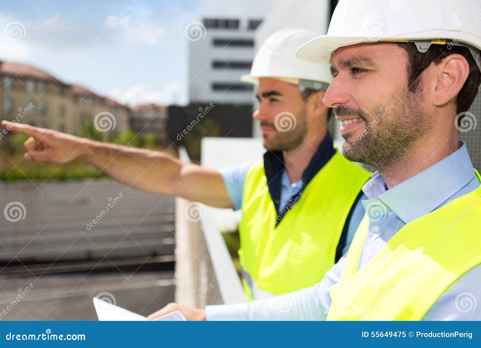 Worker and Architect Watching Some Details on a Construction Stock ...