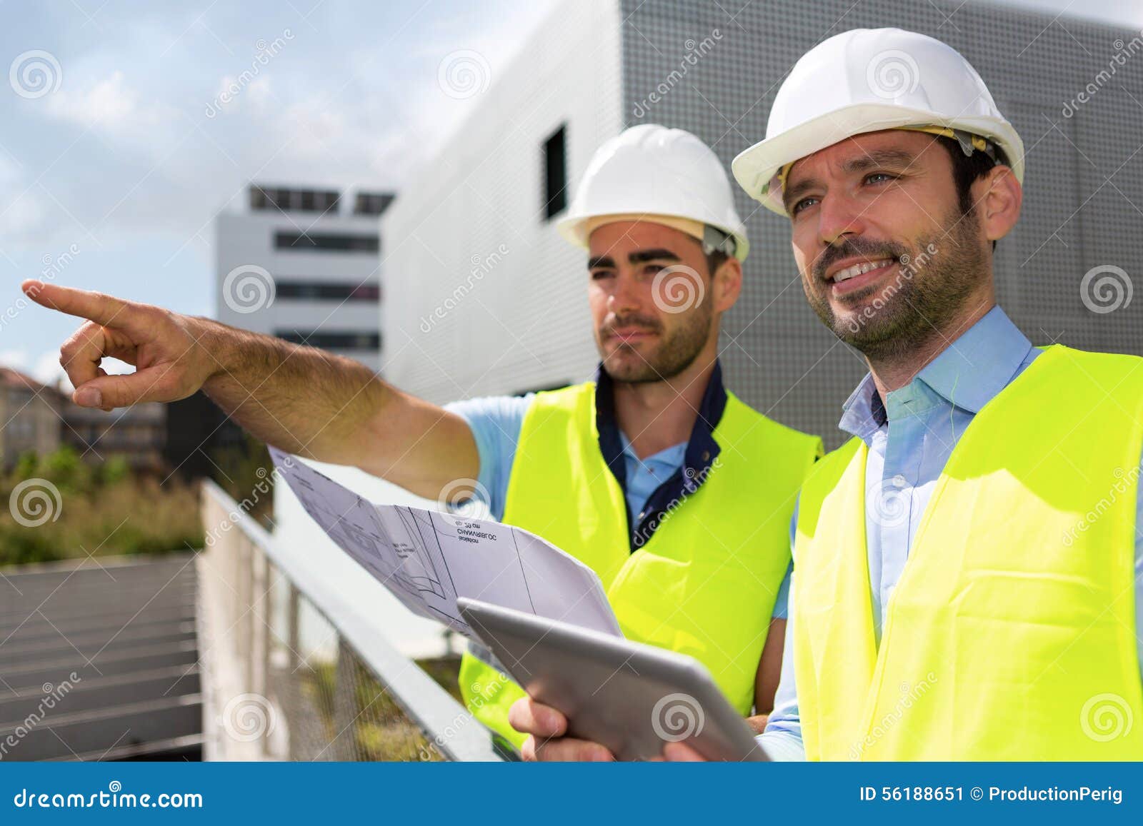 Worker and Architect Watching Some Details on a Construction Stock ...