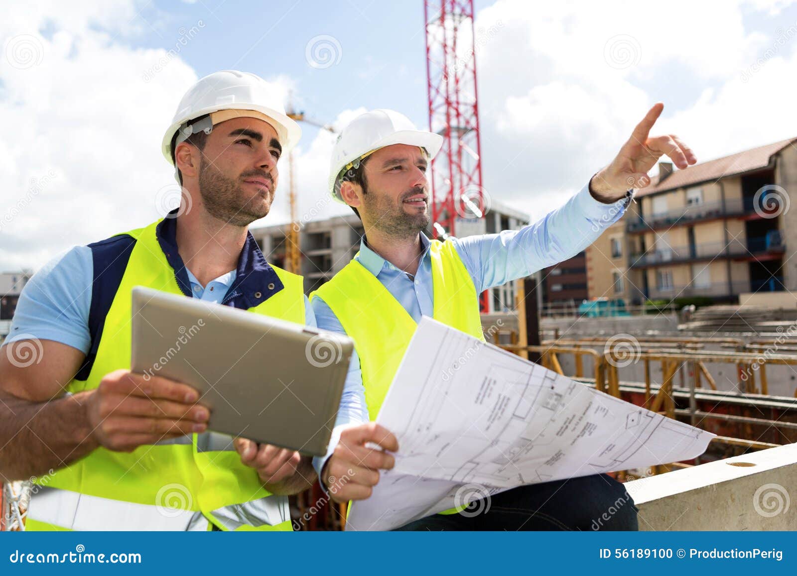 Worker and Architect Watching Some Details on a Construction Stock ...