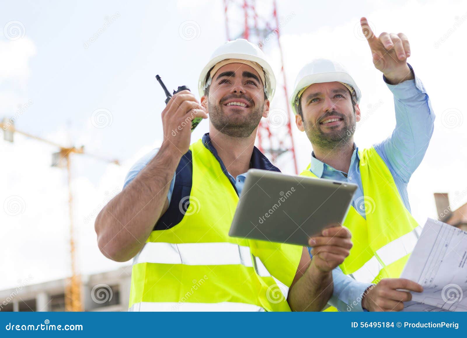 Worker and Architect Watching Some Details on a Construction Stock ...