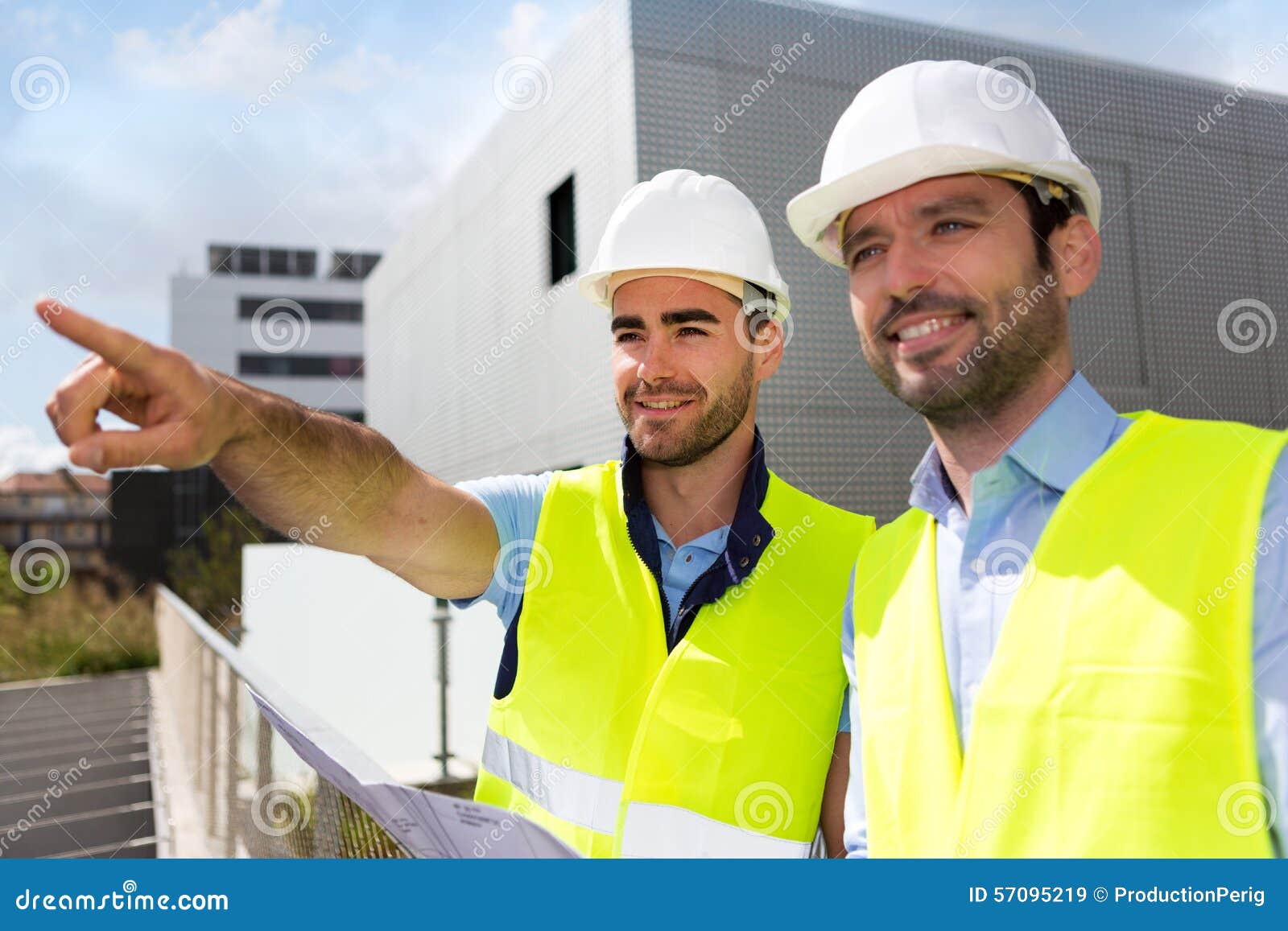 Worker and Architect Watching Some Details on a Construction Stock ...