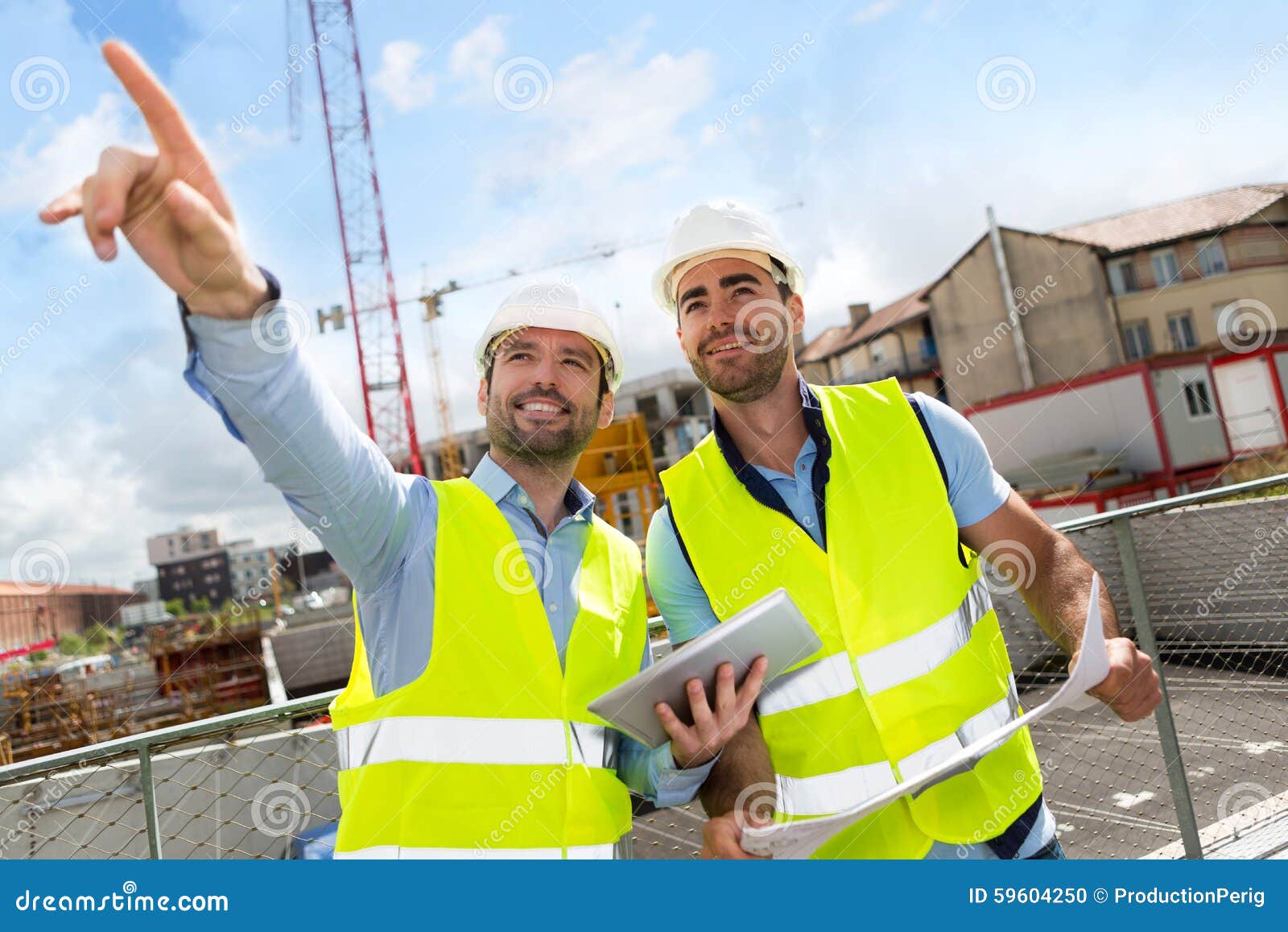 Worker and Architect Watching Some Details on a Construction Stock ...