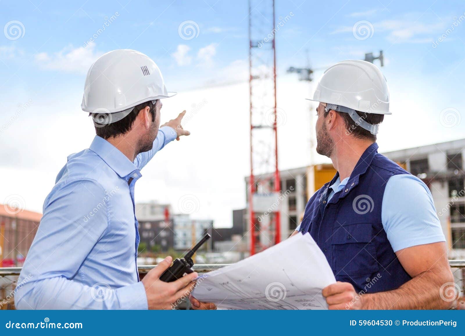 Worker and Architect Watching Some Details on a Construction Stock ...