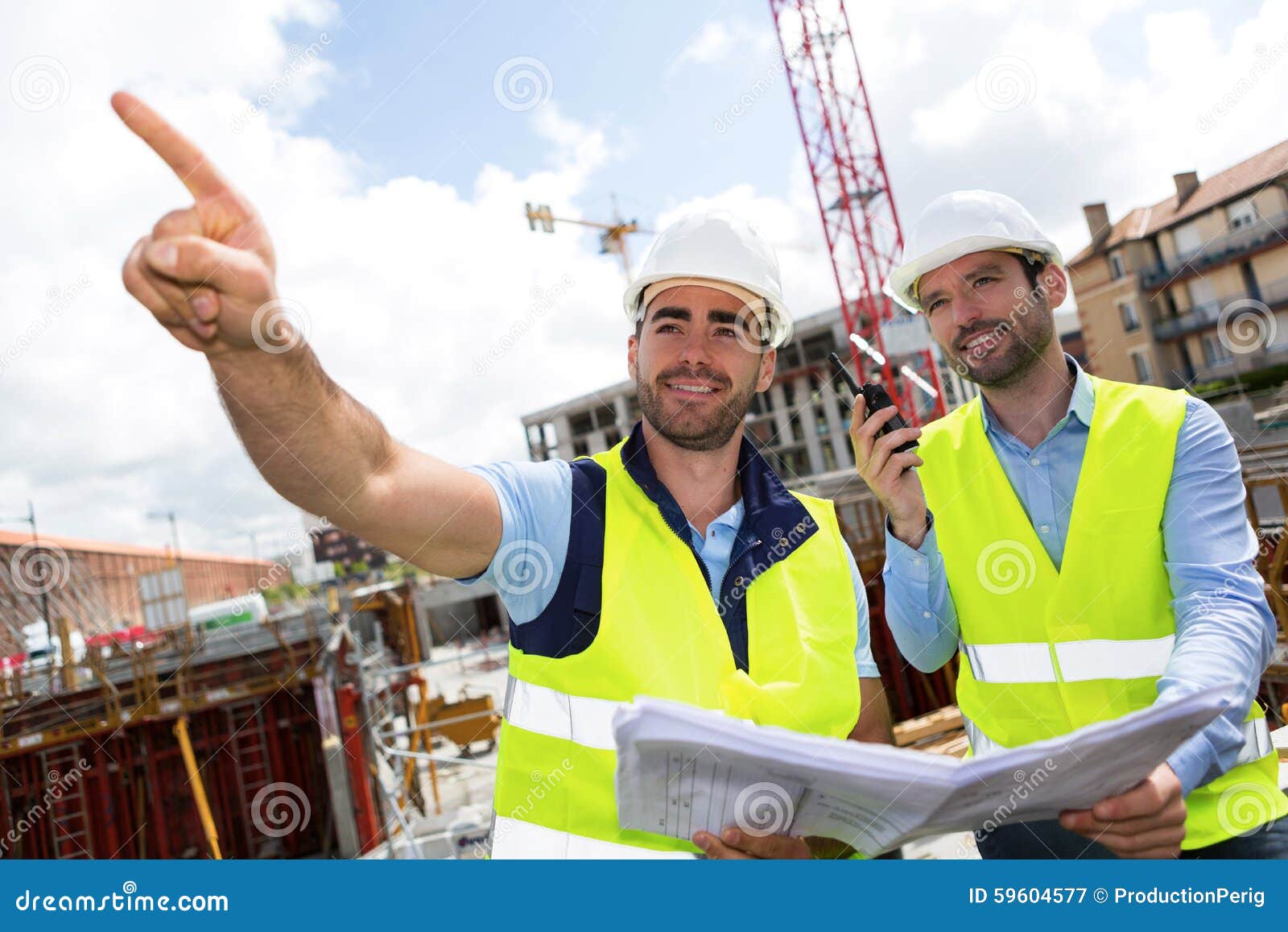 Worker and Architect Watching Some Details on a Construction Stock ...