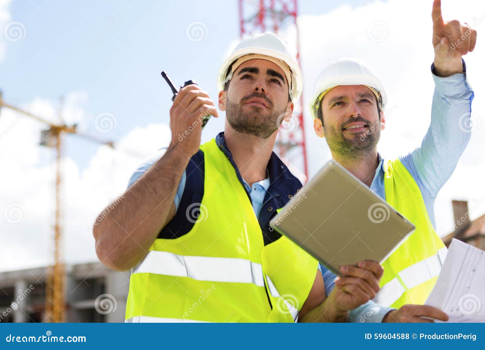 Worker and Architect Watching Some Details on a Construction Stock ...