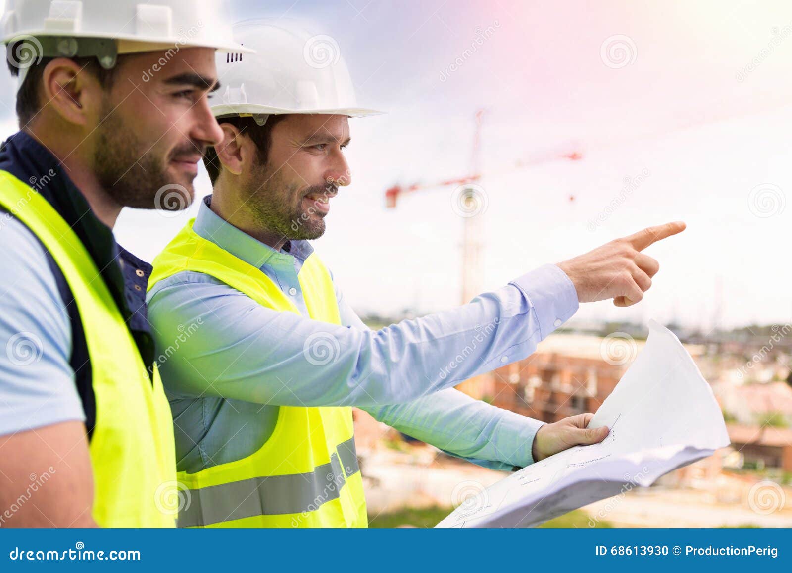 Worker and Architect Watching Some Details on a Construction Stock ...