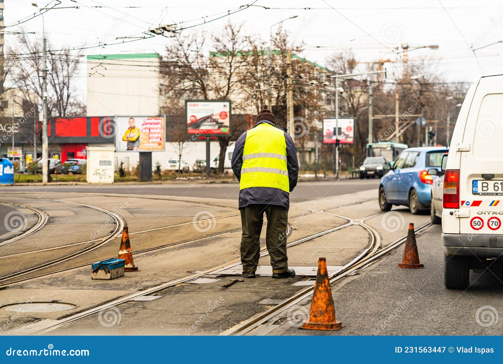 Worker Arranging Traffic Cone on Tram Railway in Bucharest, Romania ...