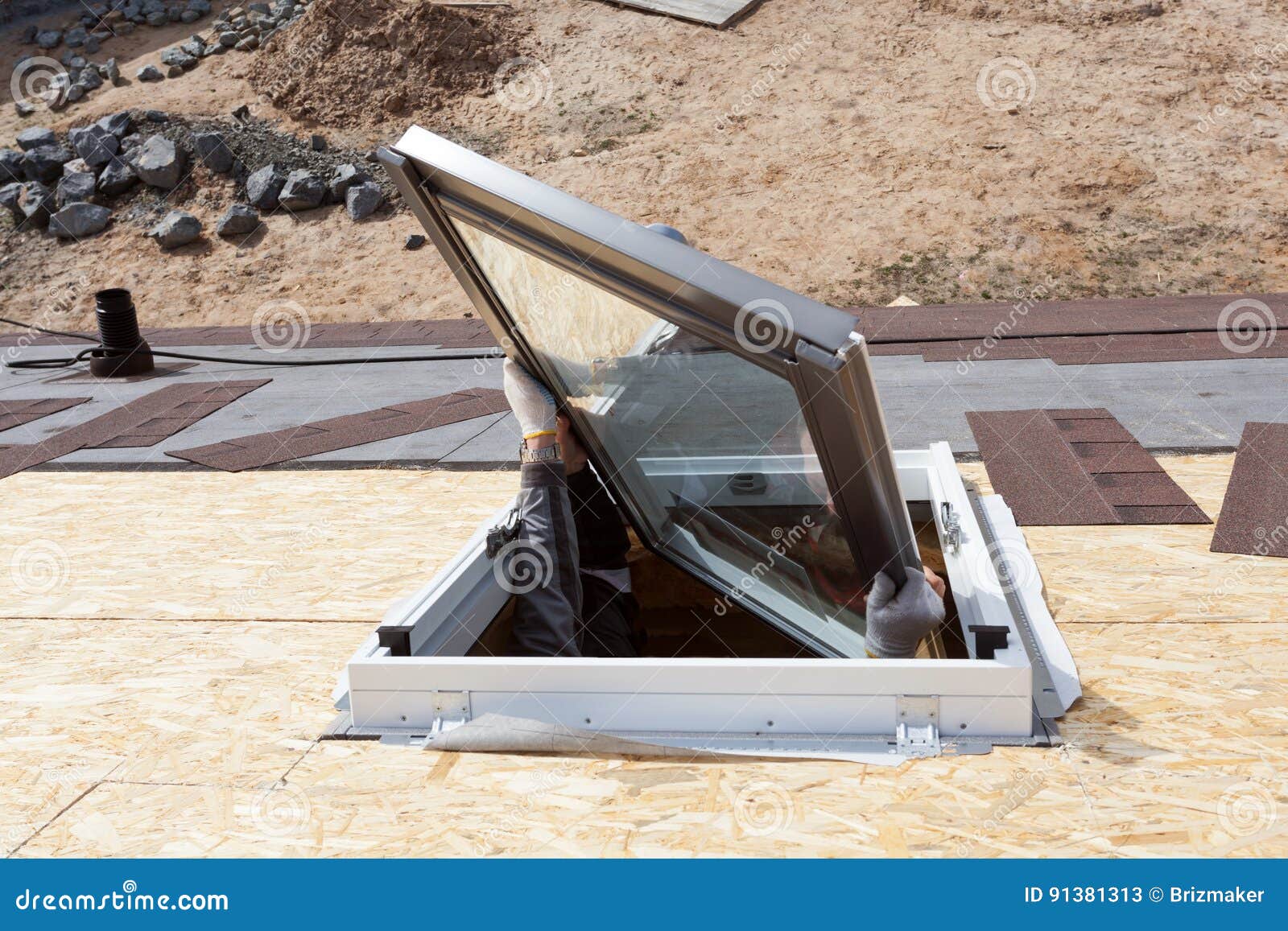 Worker on a Asphalt Shingle Roof Installing New Plastic Mansard or ...