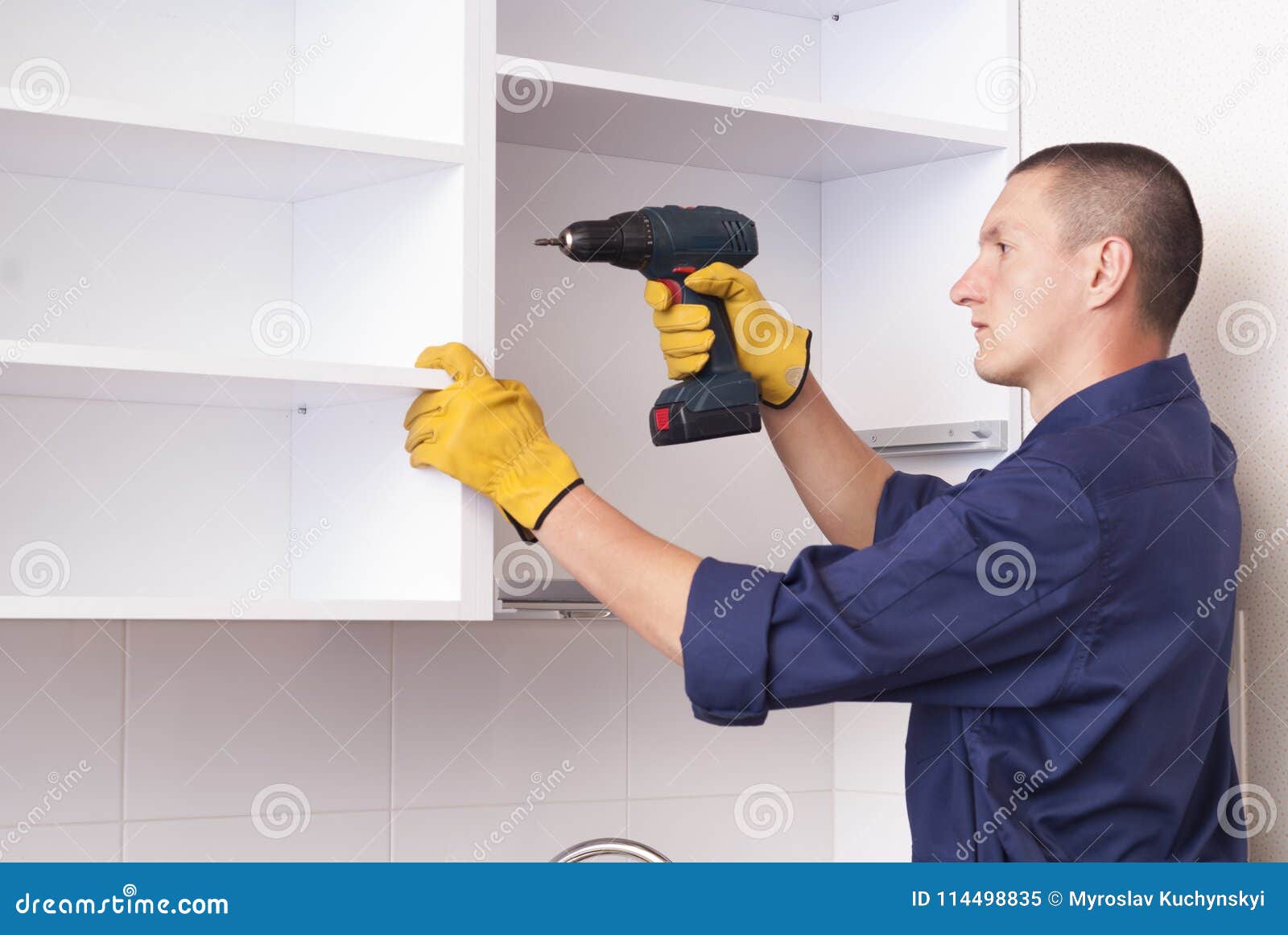 Worker Assembles Furniture in the Kitchen Stock Image - Image of ...