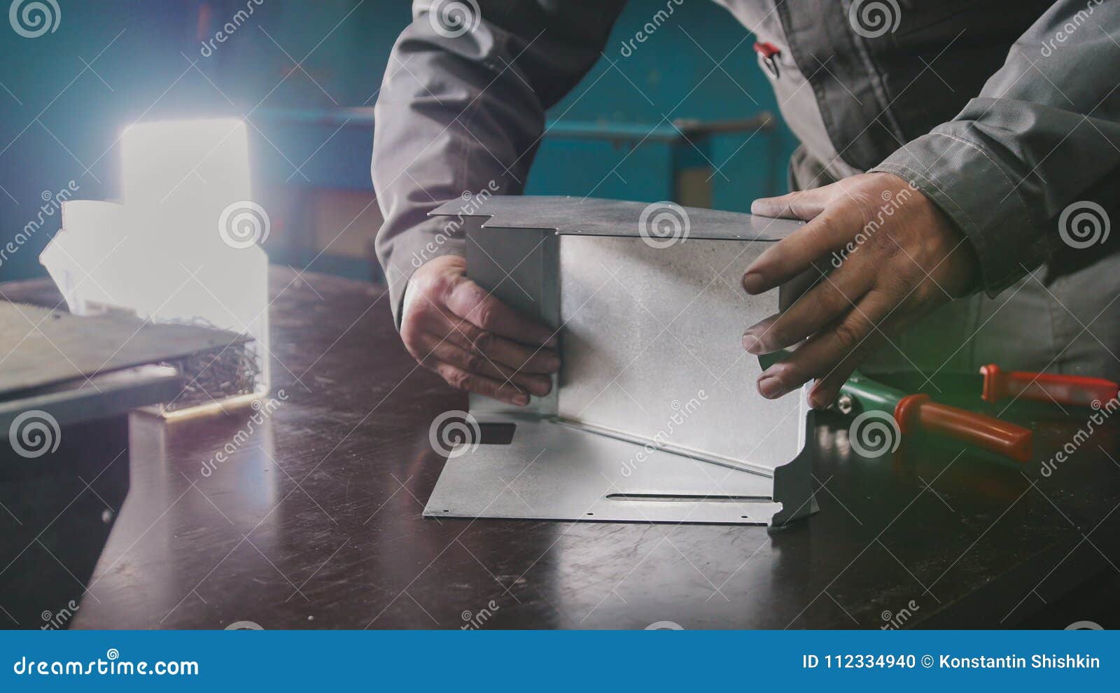Worker Assembling the Metal Part in the Manual Stock Photo - Image of ...