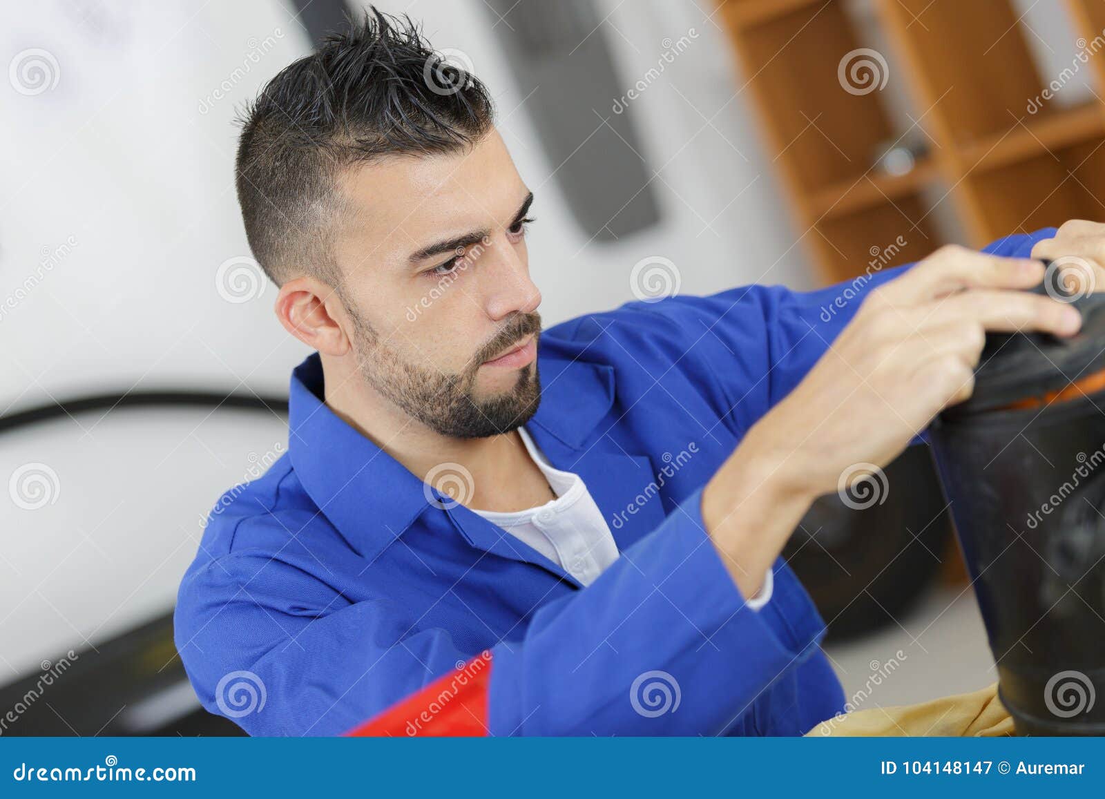 Worker Assembling Something in Workshop Stock Image - Image of gear ...