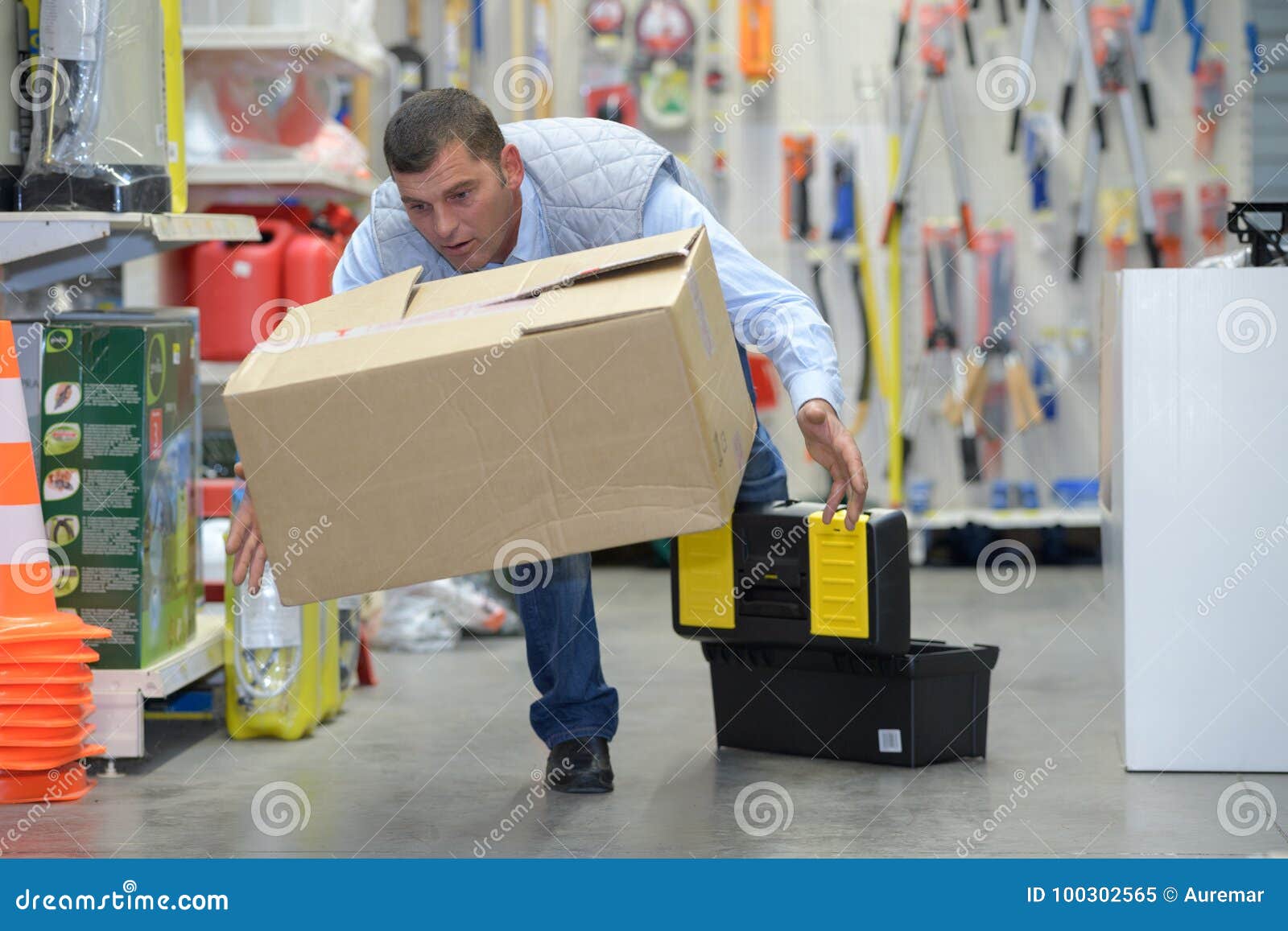 Worker with Backache while Lifting Box in Warehouse Stock Image - Image ...