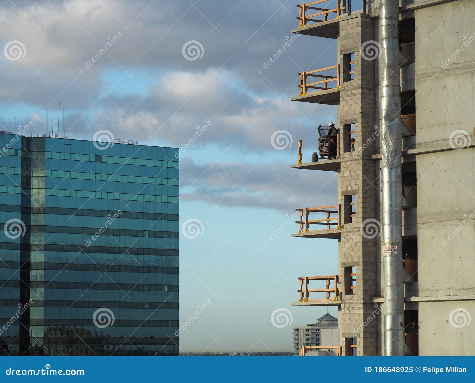 Worker on Balcony at Construction Site Stock Image - Image of balcony ...