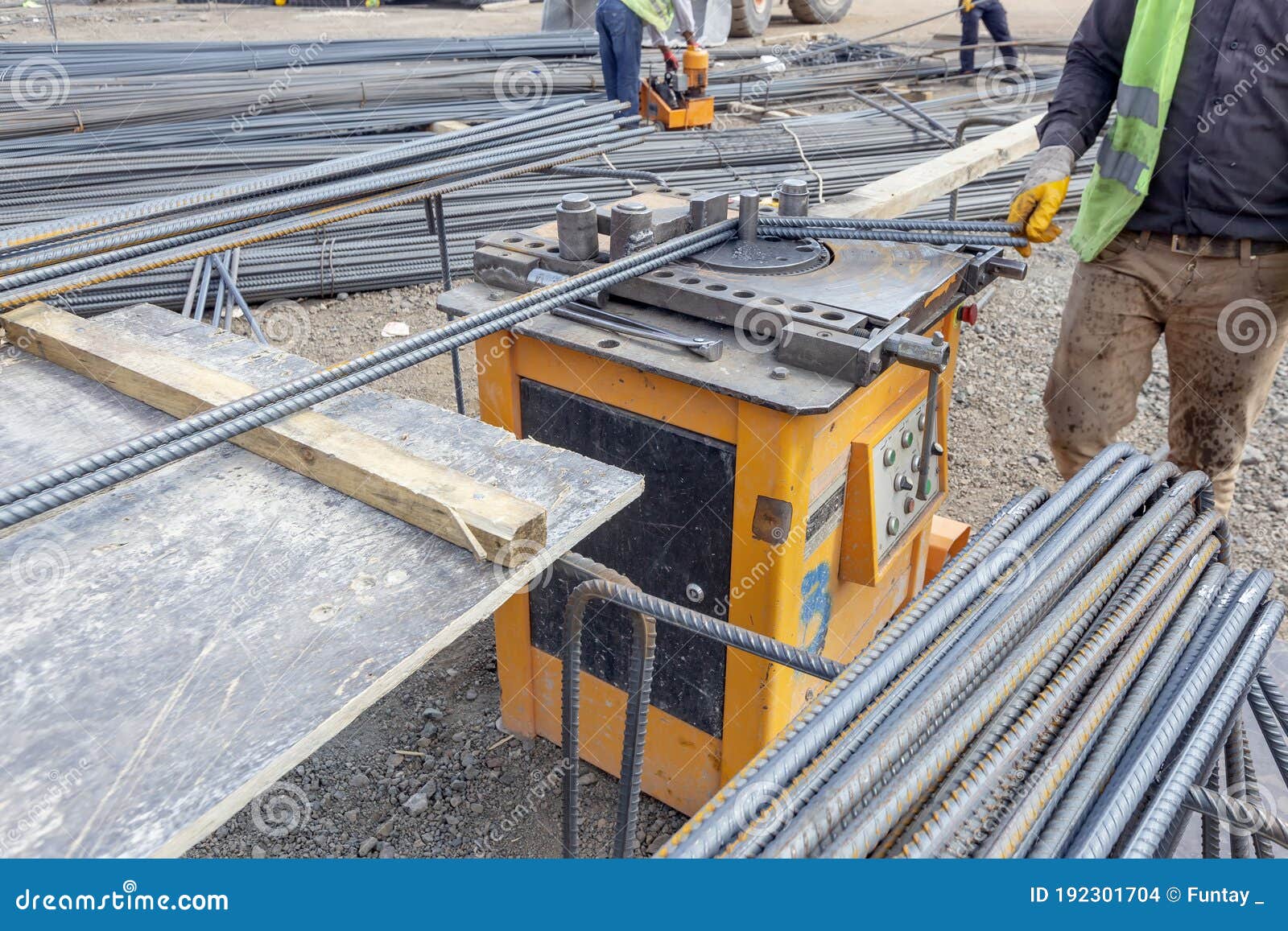 The Worker is Bending Rebars Rods in the Construction Site. Stock Photo ...