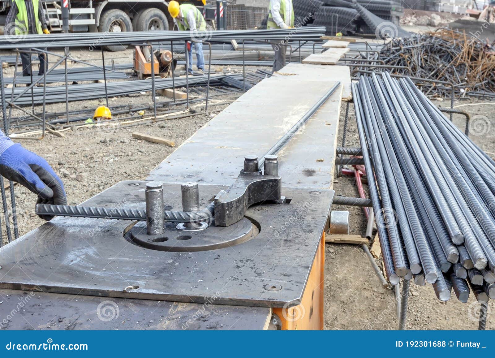 The Worker is Bending Rebars Rods in the Construction Site. Stock Photo ...