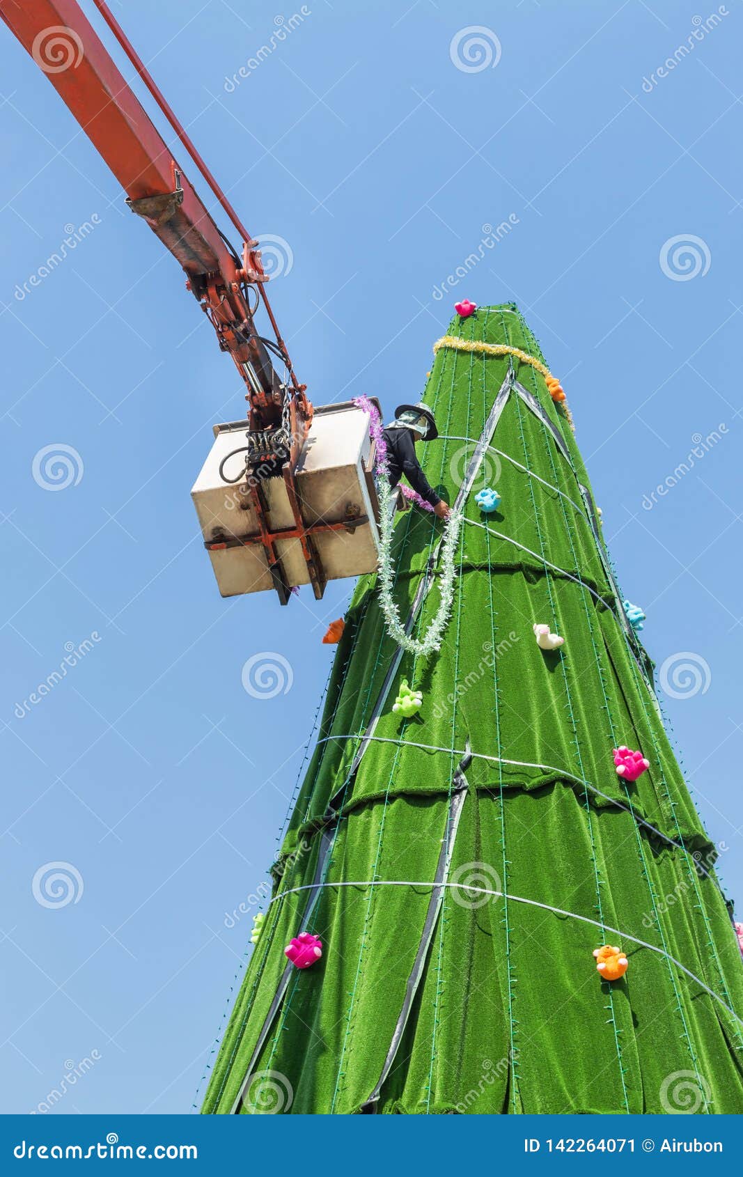 Worker on Big Crane during Install and Decoration Ornament the ...