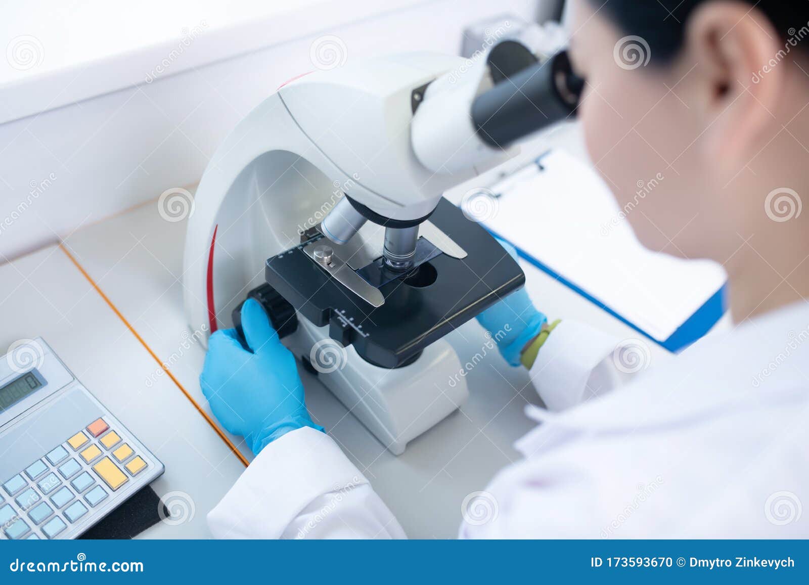 Worker of Biochemical Laboratory Looking in Microscope Stock Photo ...