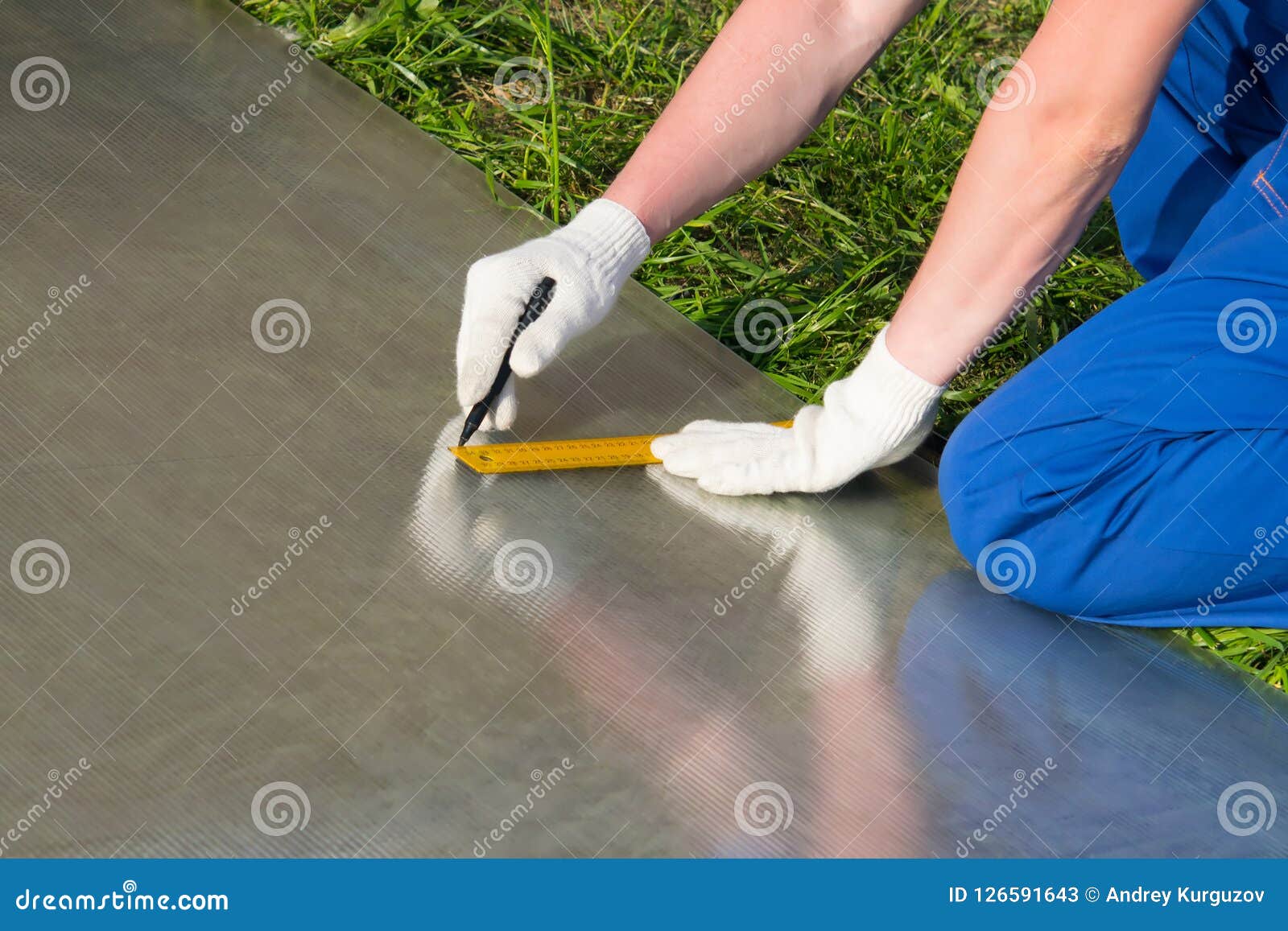 Worker in Blue Uniform and Gloves, Marks the Line of Cutting Off the ...