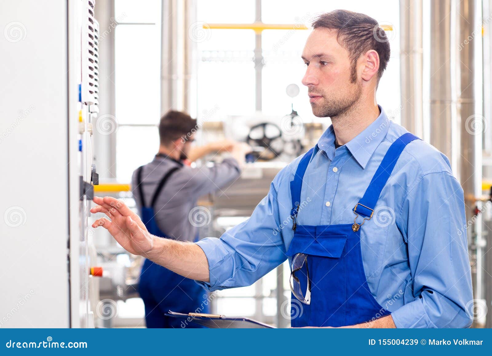 Worker in Front of Control Cabinet Stock Image - Image of plant ...