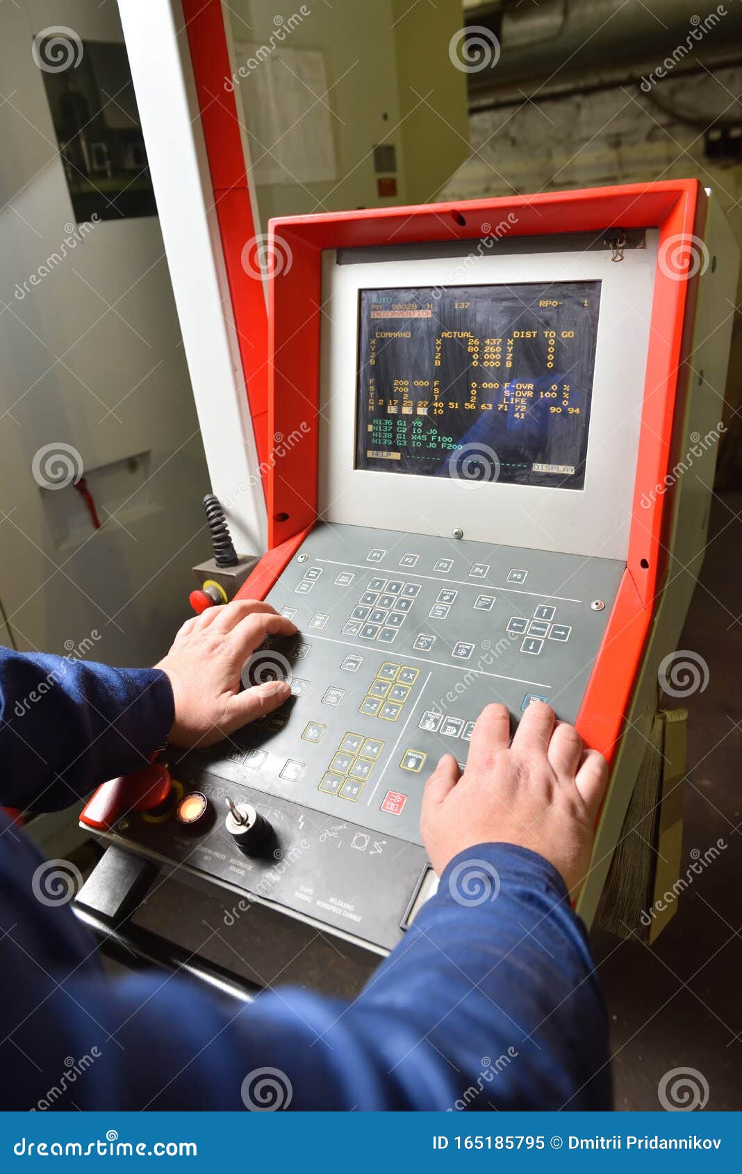 Worker in Blue Workwear Holds Hands on the Control Panel of the CNC ...