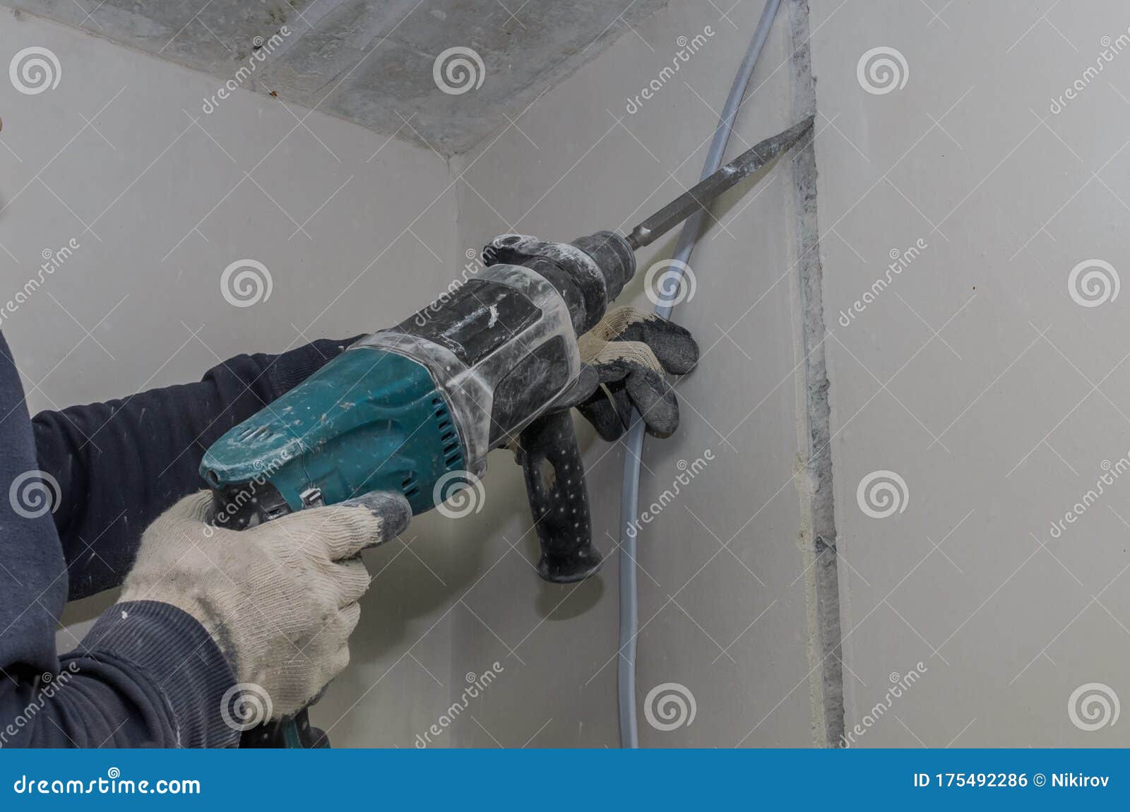 Worker Breaks a Concrete Wall with a Perforator Chisel Stock Photo ...