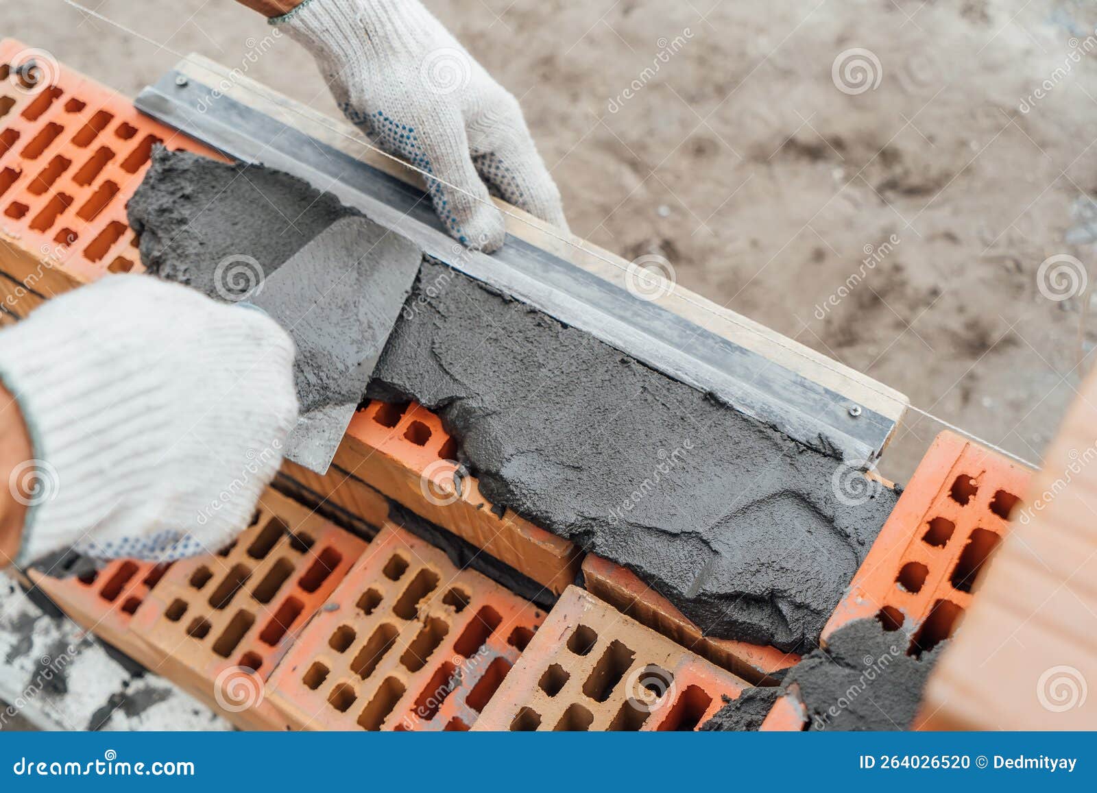 Worker or Bricklayer Works with Trowel Laying Bricks. Builder Makes ...