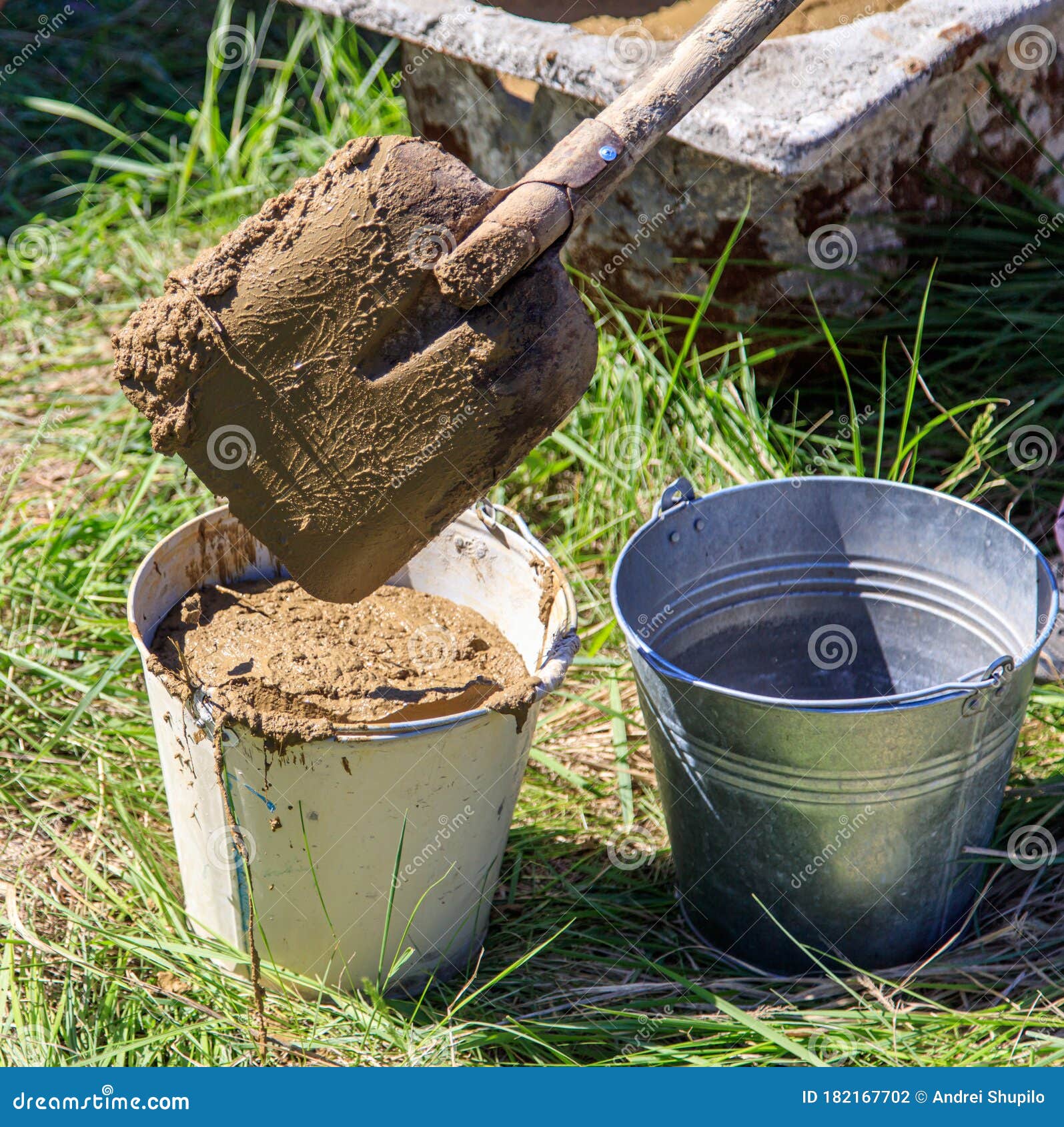 Worker with Buckets of Concrete at a House Construction Stock Photo ...
