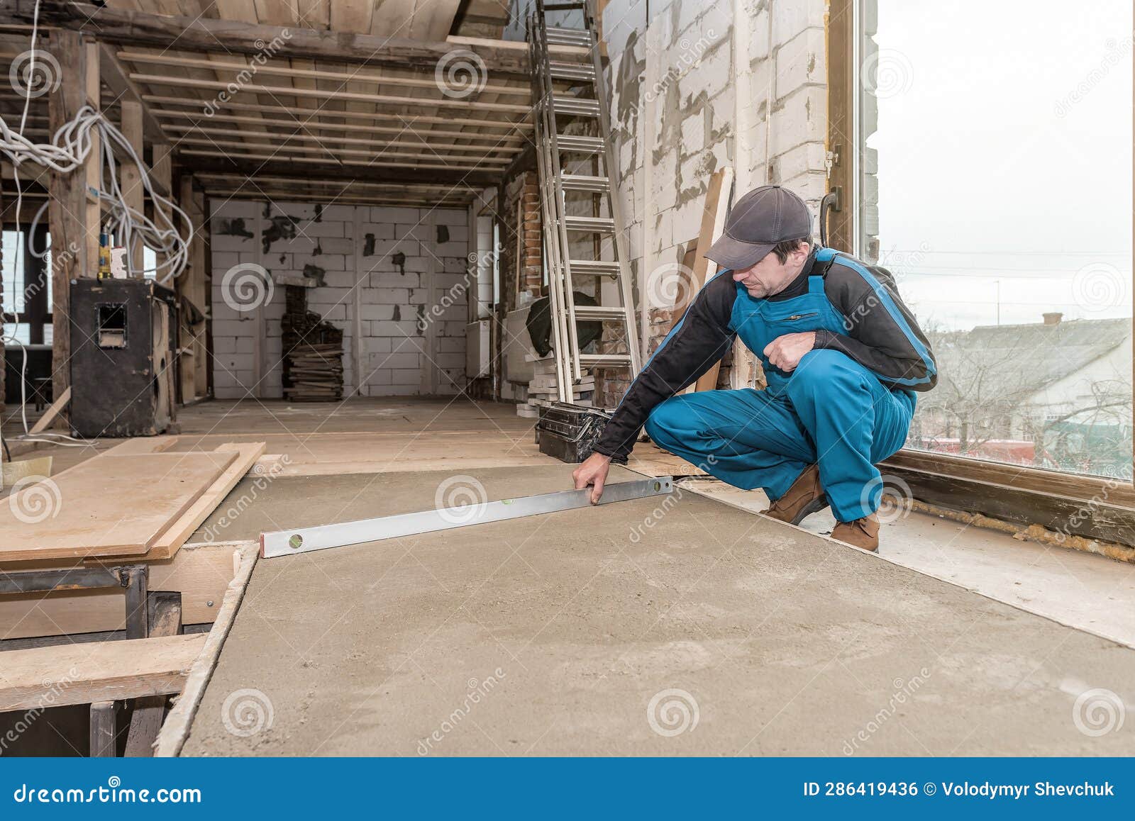 Worker Builder Checking the Level of the Concrete Floor Stock Photo ...