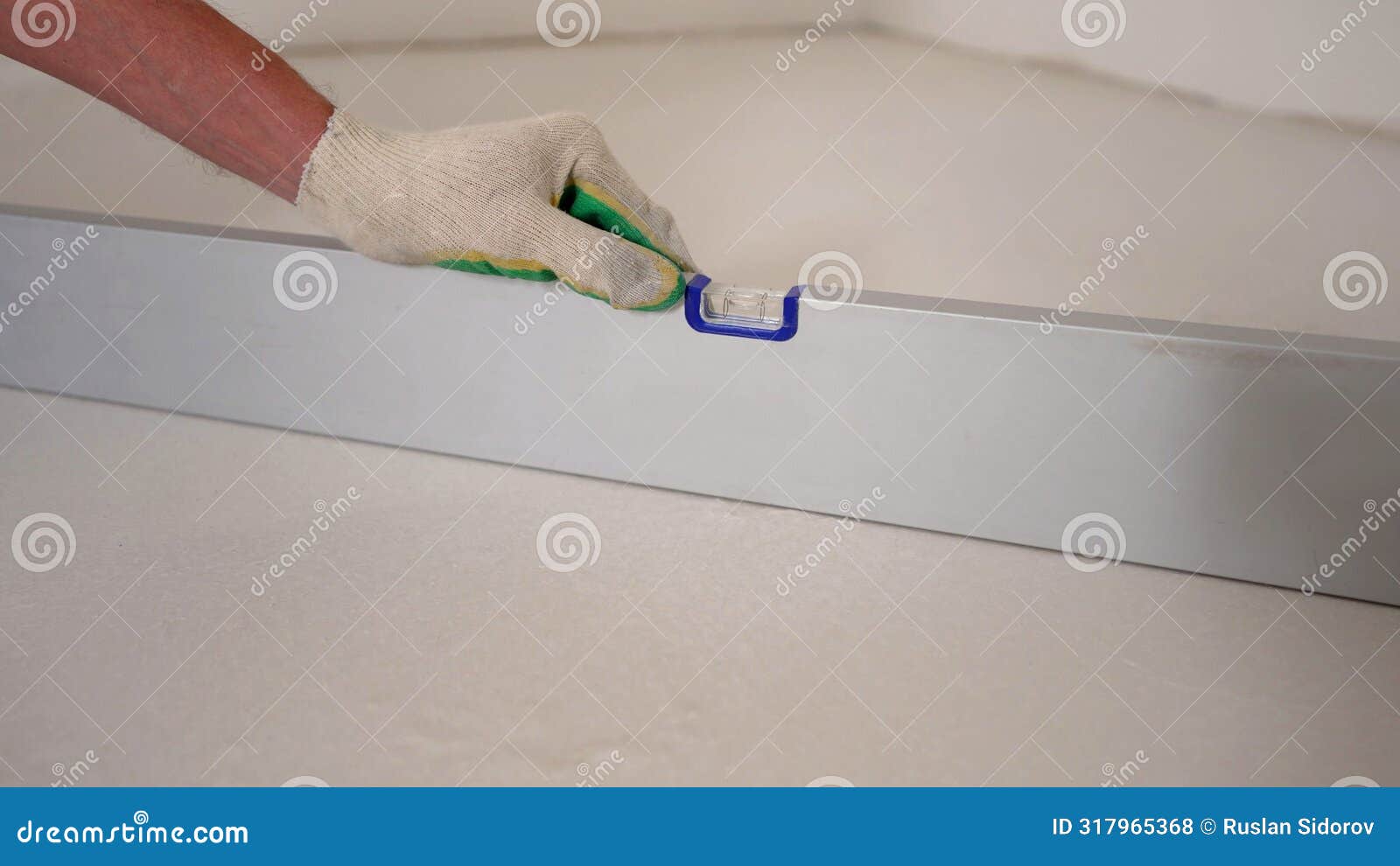 Worker Builder Checking the Level of the Concrete Floor. Checking the ...