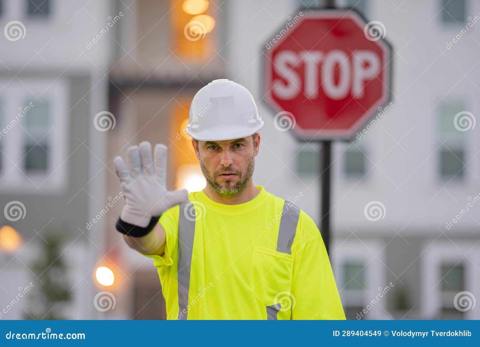 Worker Builder in Hard Hat with Stop Road Sign. Builder with Stop ...
