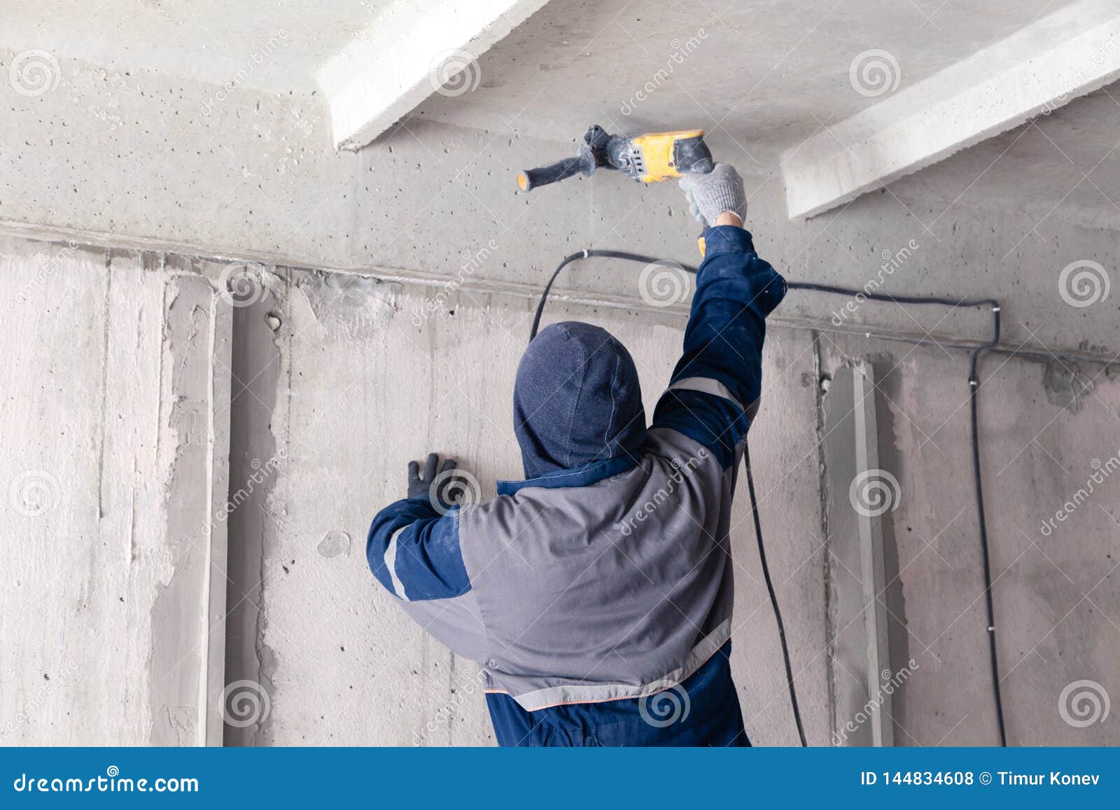 Worker Builder Makes Electrical Wiring, Drills the Ceiling with Drill ...