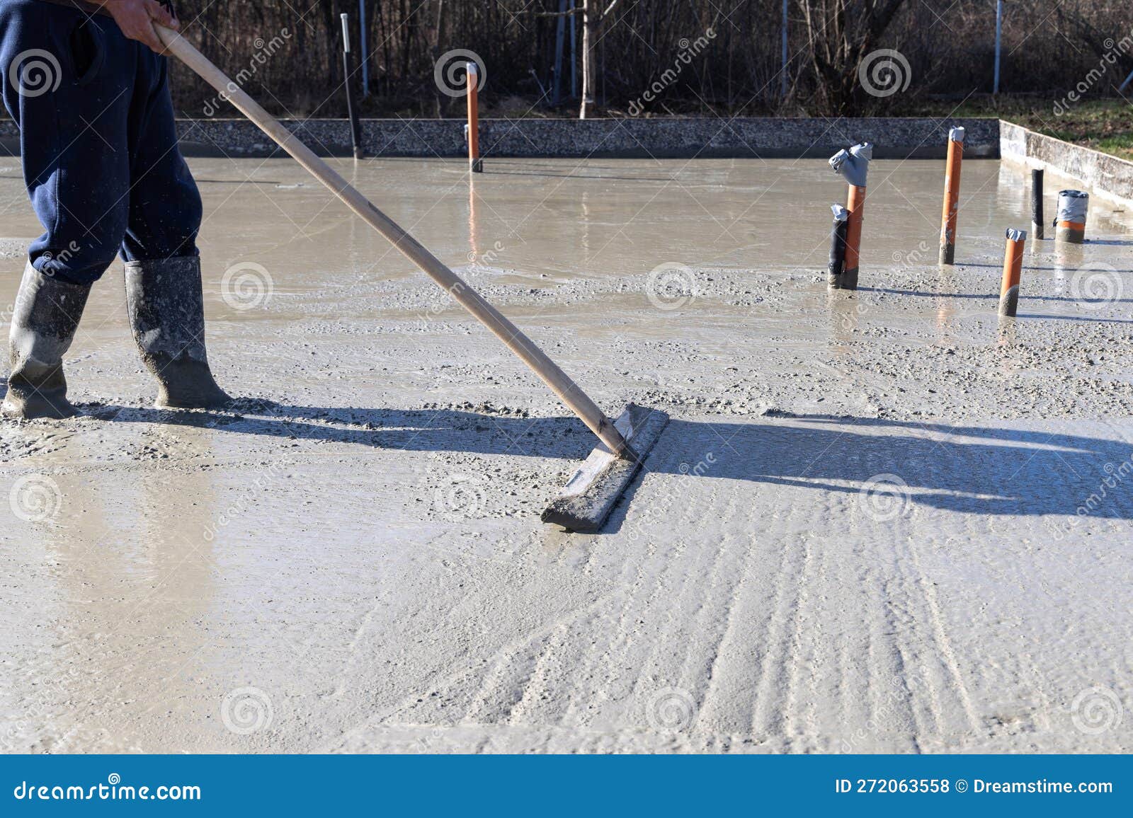 Worker Builder Smoothing Concrete on a Construction Site Stock Photo ...