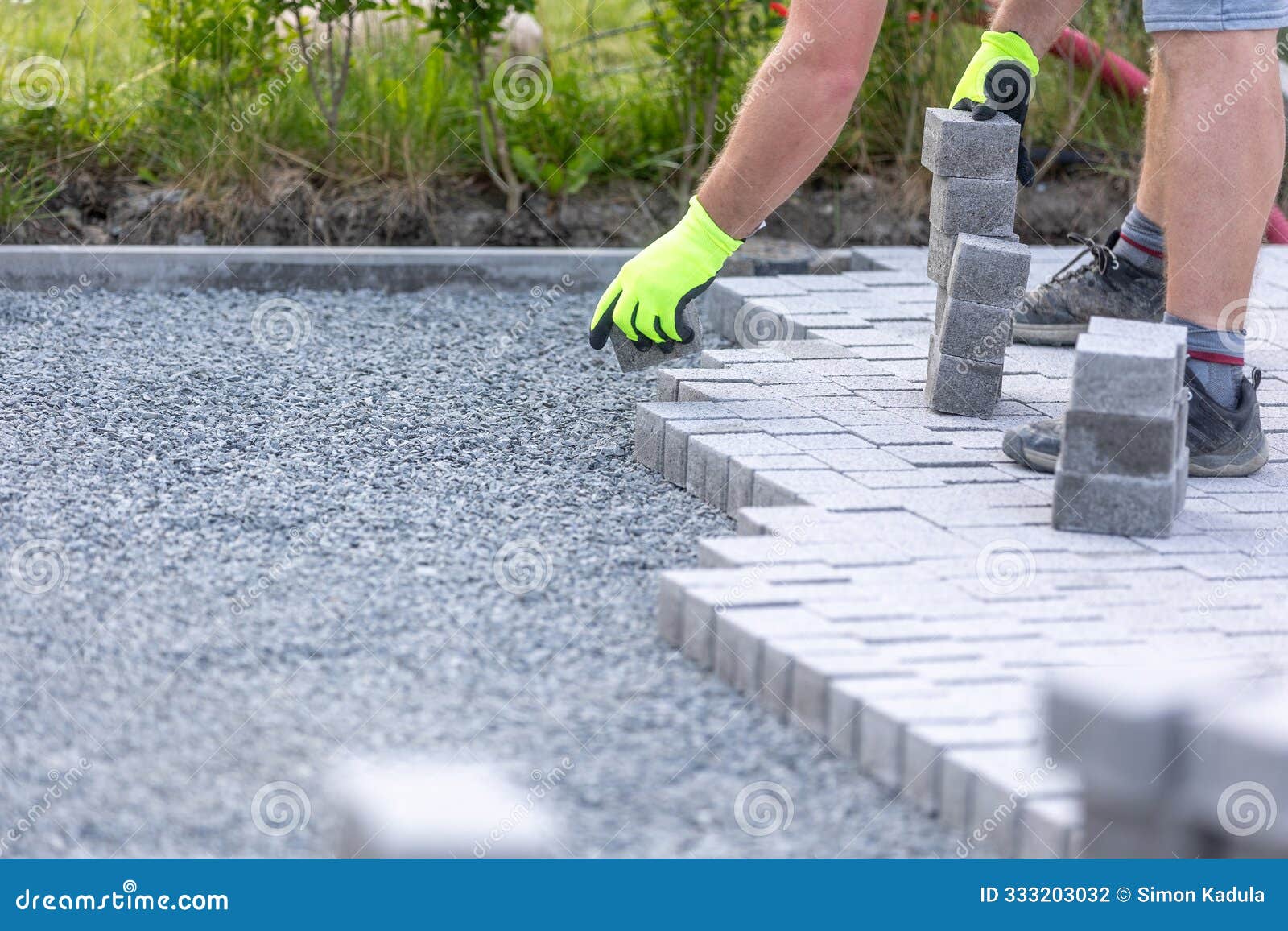 Worker Building a New Interlocking Pavement from Concrete Paving, a New ...