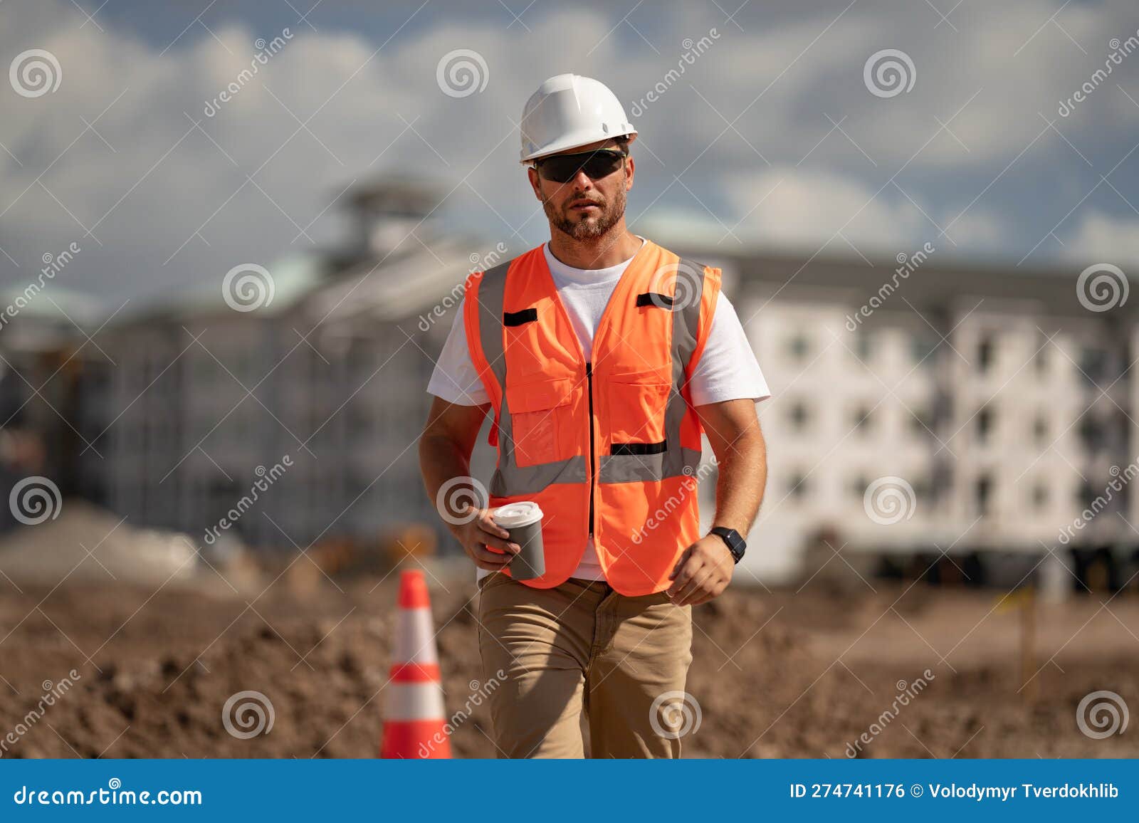 Worker in Building Uniform on Buildings Construction Background ...