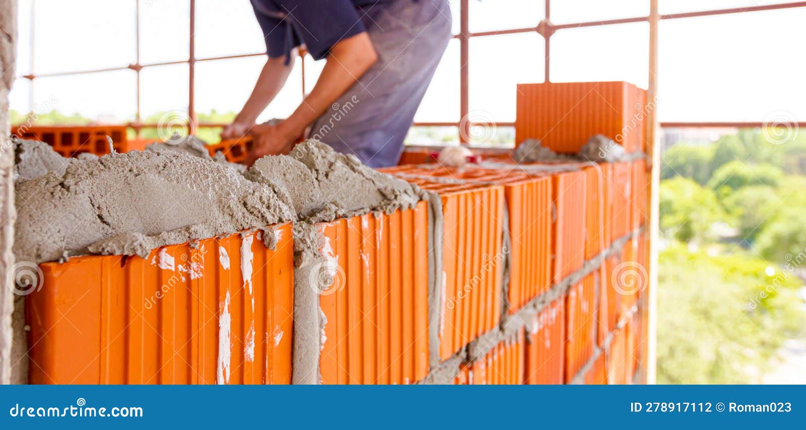 Worker is Building Wall with Red Blocks and Mortar Stock Photo - Image ...