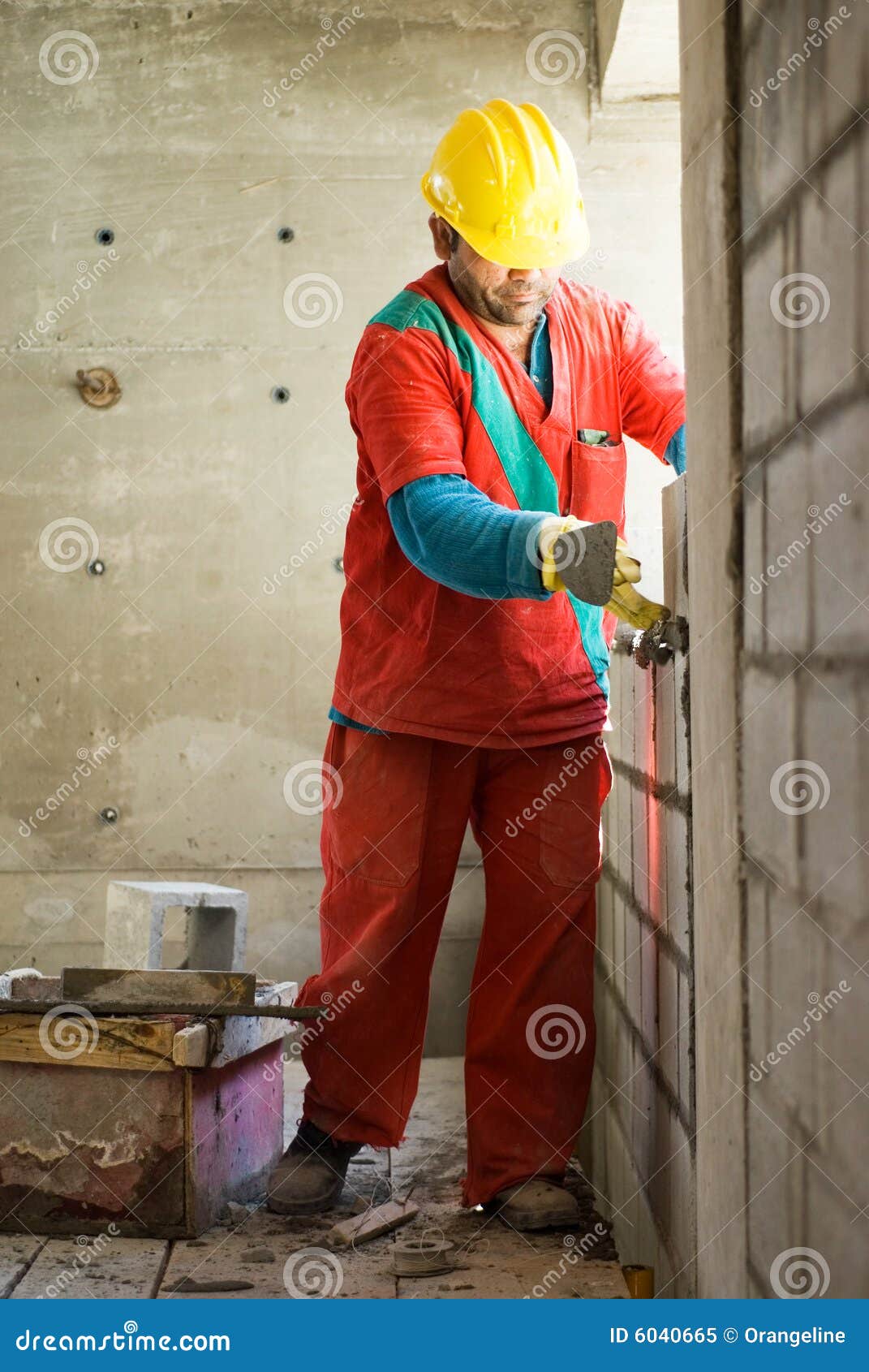 Worker Builds Wall - Vertical Picture. Image: 6040665