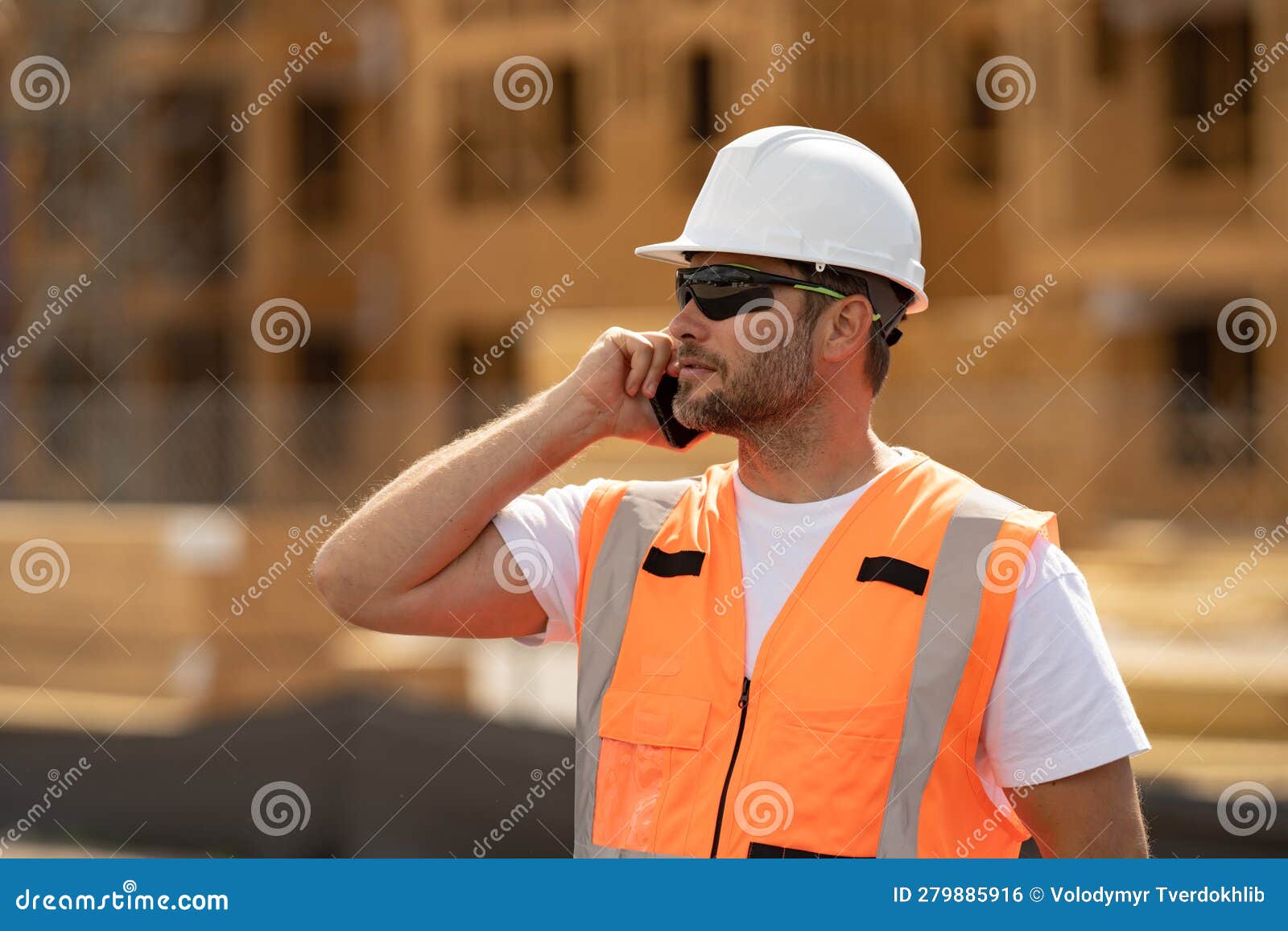 Worker Call with Phone in Building Uniform on Buildings Construction ...