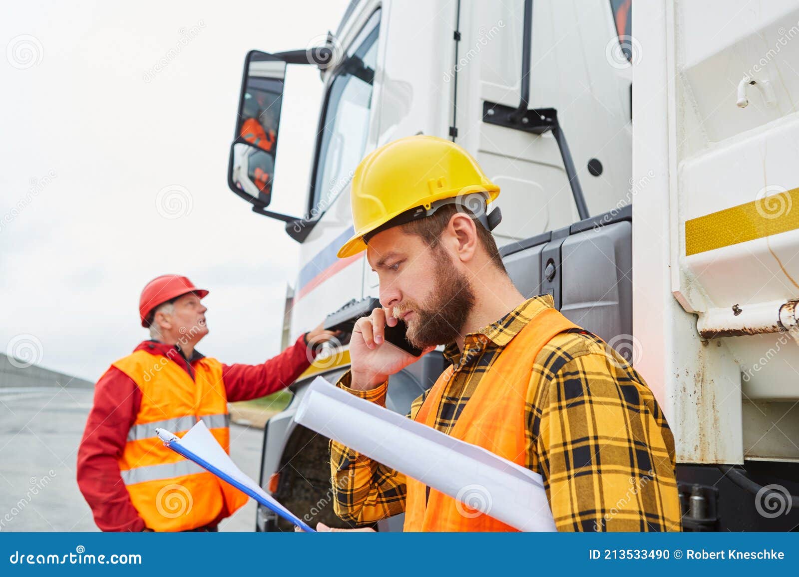 Worker Calls with Smartphone in Front of a Truck Stock Photo - Image of ...