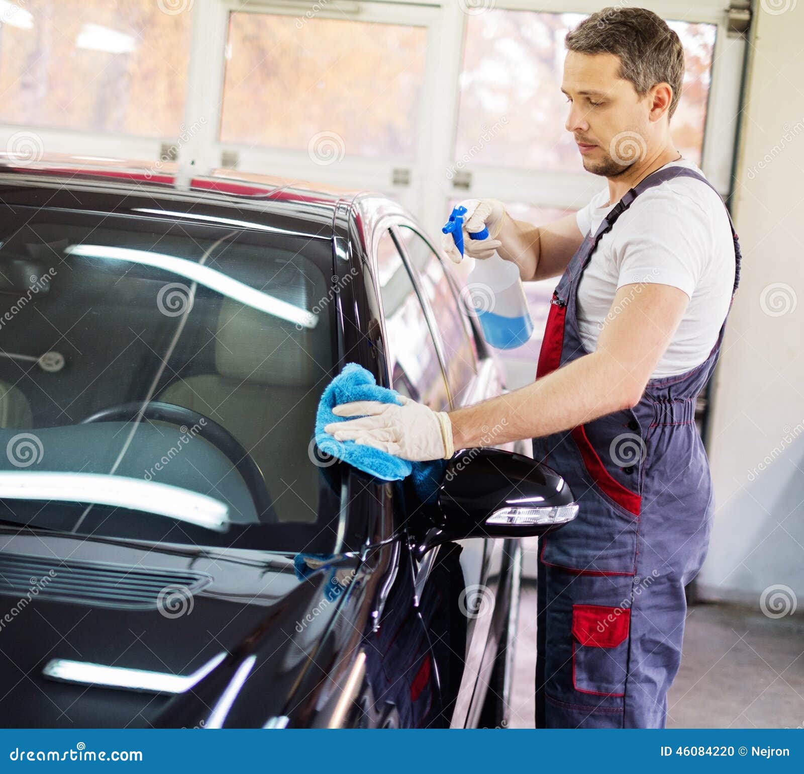 Worker on a car wash stock photo. Image of shiny, bottle - 46084220
