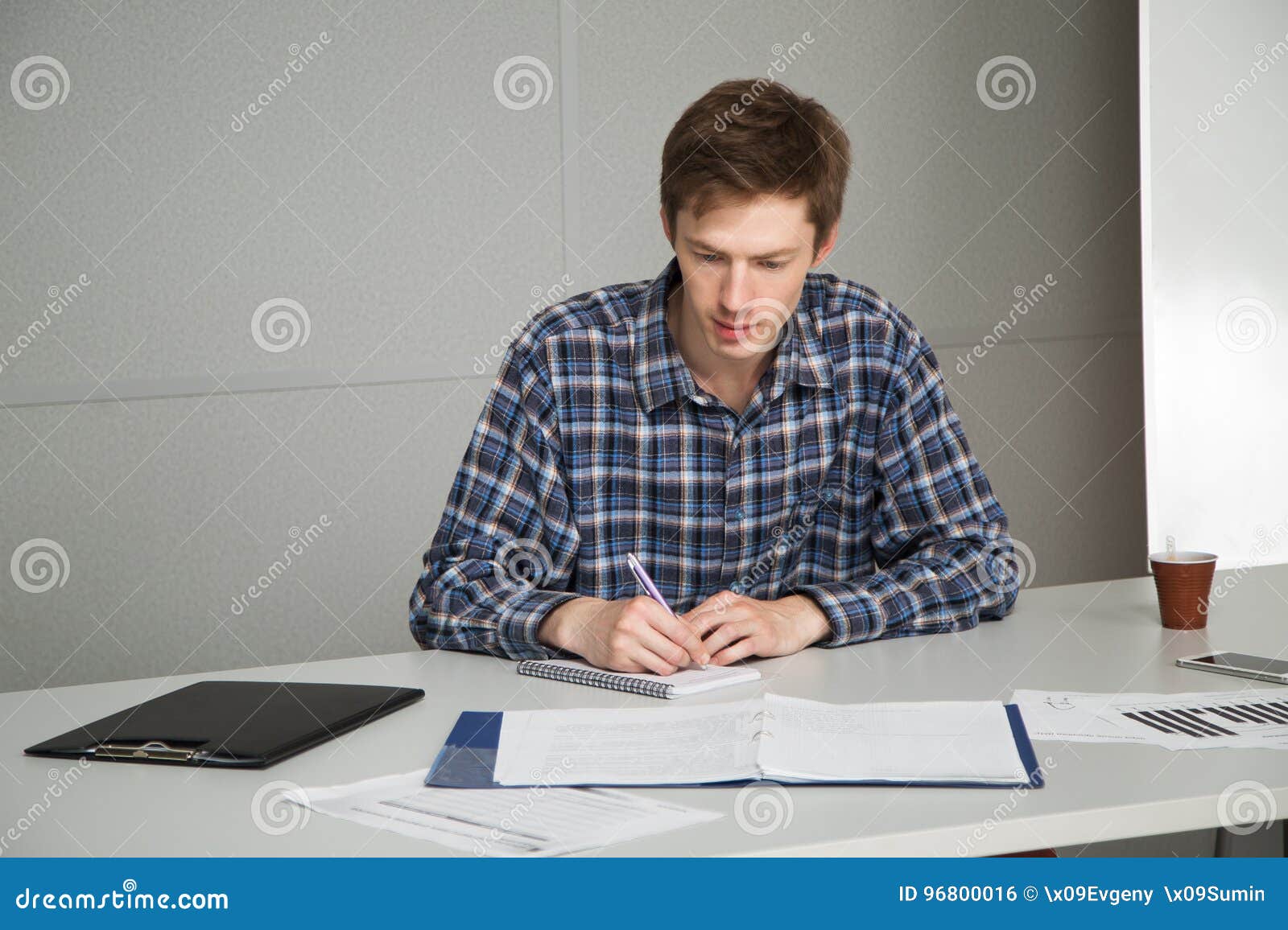 Worker is Carefully Studying the Job, Which is Received from the Head ...