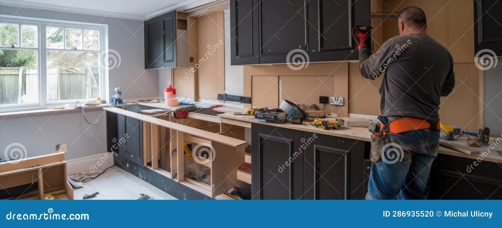 Worker or Carpenter Installing New Modern Kitchen Stock Photo - Image ...
