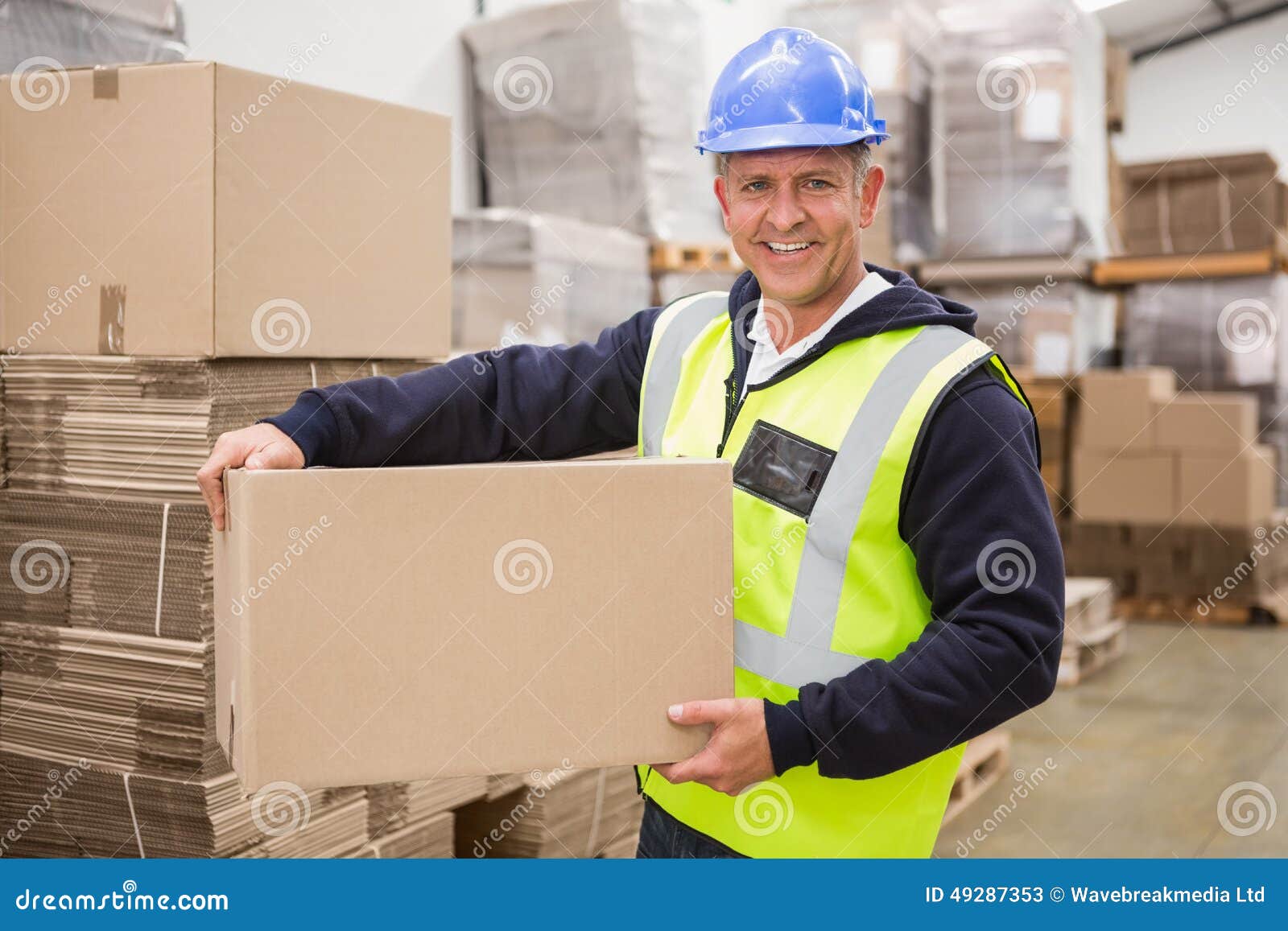 Worker Carrying Box in Warehouse Stock Image - Image of standing ...