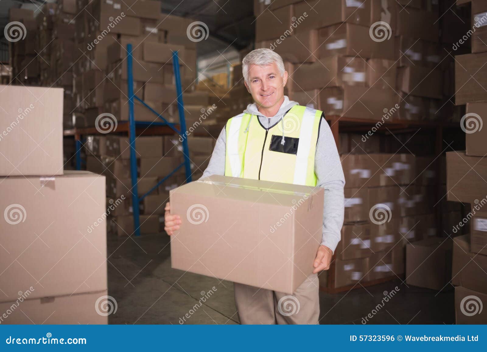 Worker Carrying Box in Warehouse Stock Photo - Image of person, smiling ...